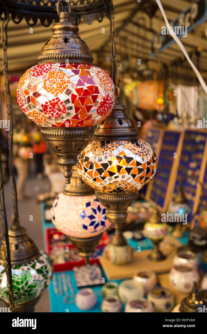 Moroccan crafts on a market stall, lamps in the foreground Stock Photo ...