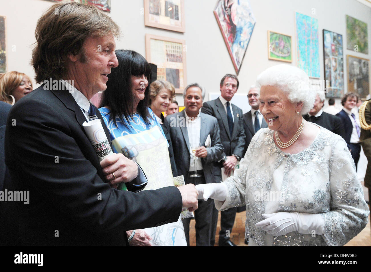 Queen Elizabeth II meets Paul McCartney and Sandie Shaw during her ...