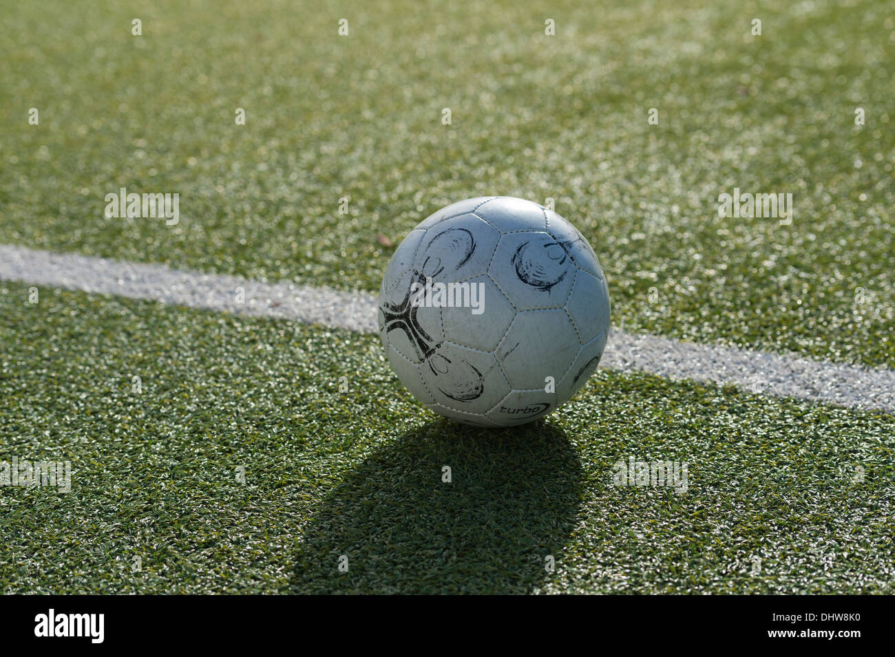 Football on all weather Astro Turf pitch Stock Photo - Alamy