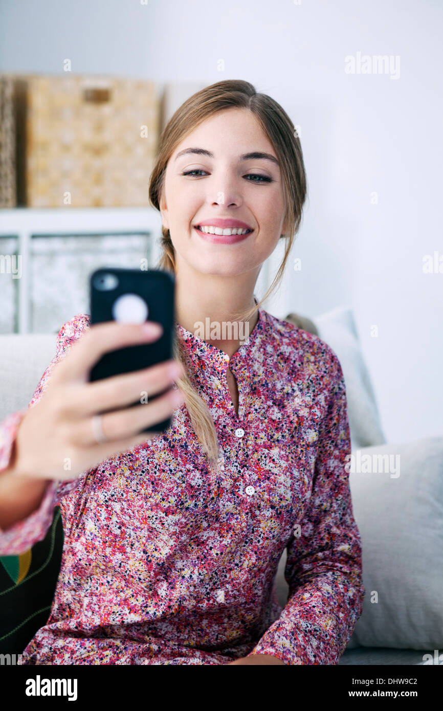 Woman smart phone sit on hi-res stock photography and images - Alamy