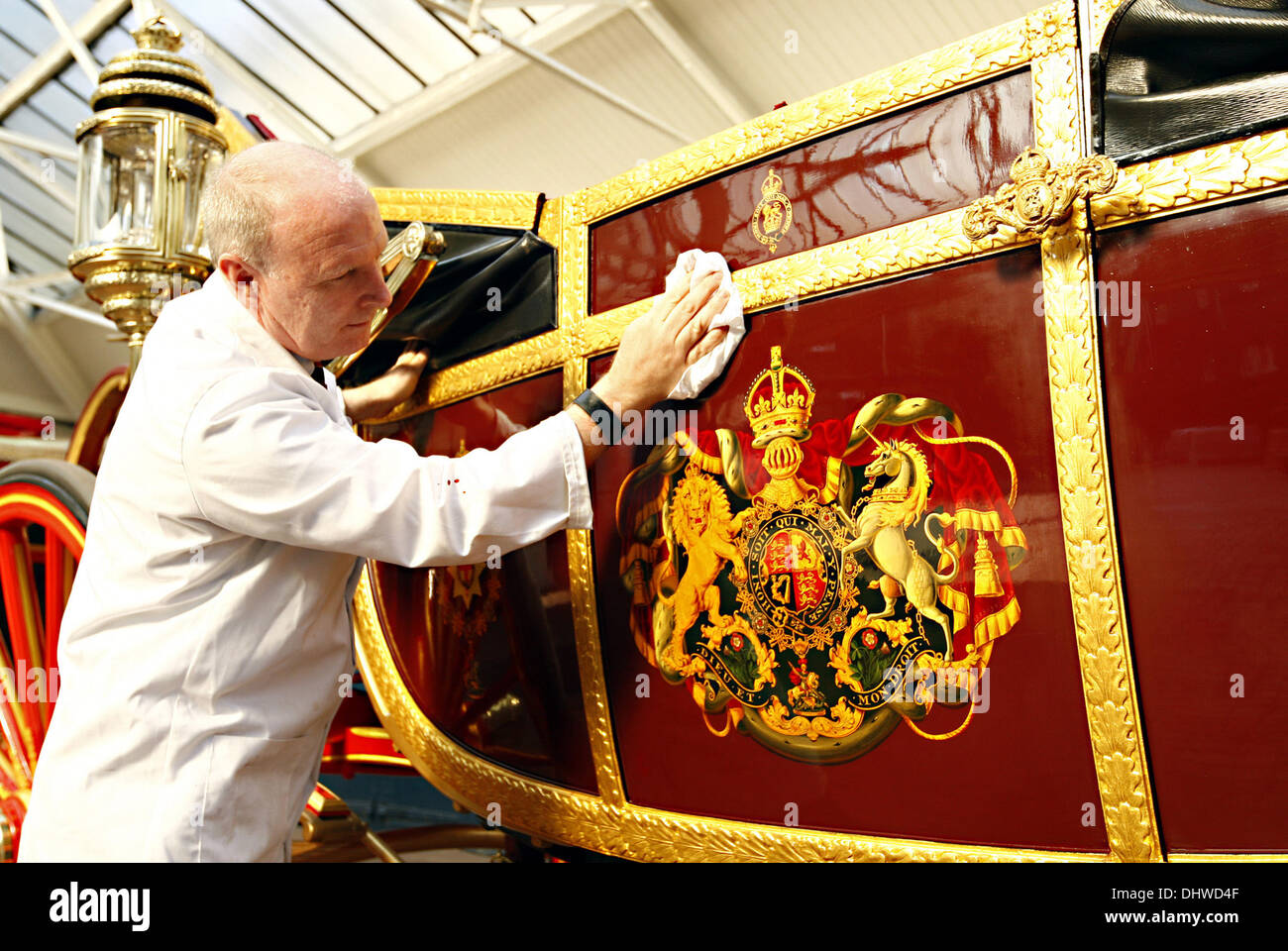 Carriage restorer David Evens cleans the 1902 State Landau carriage at ...