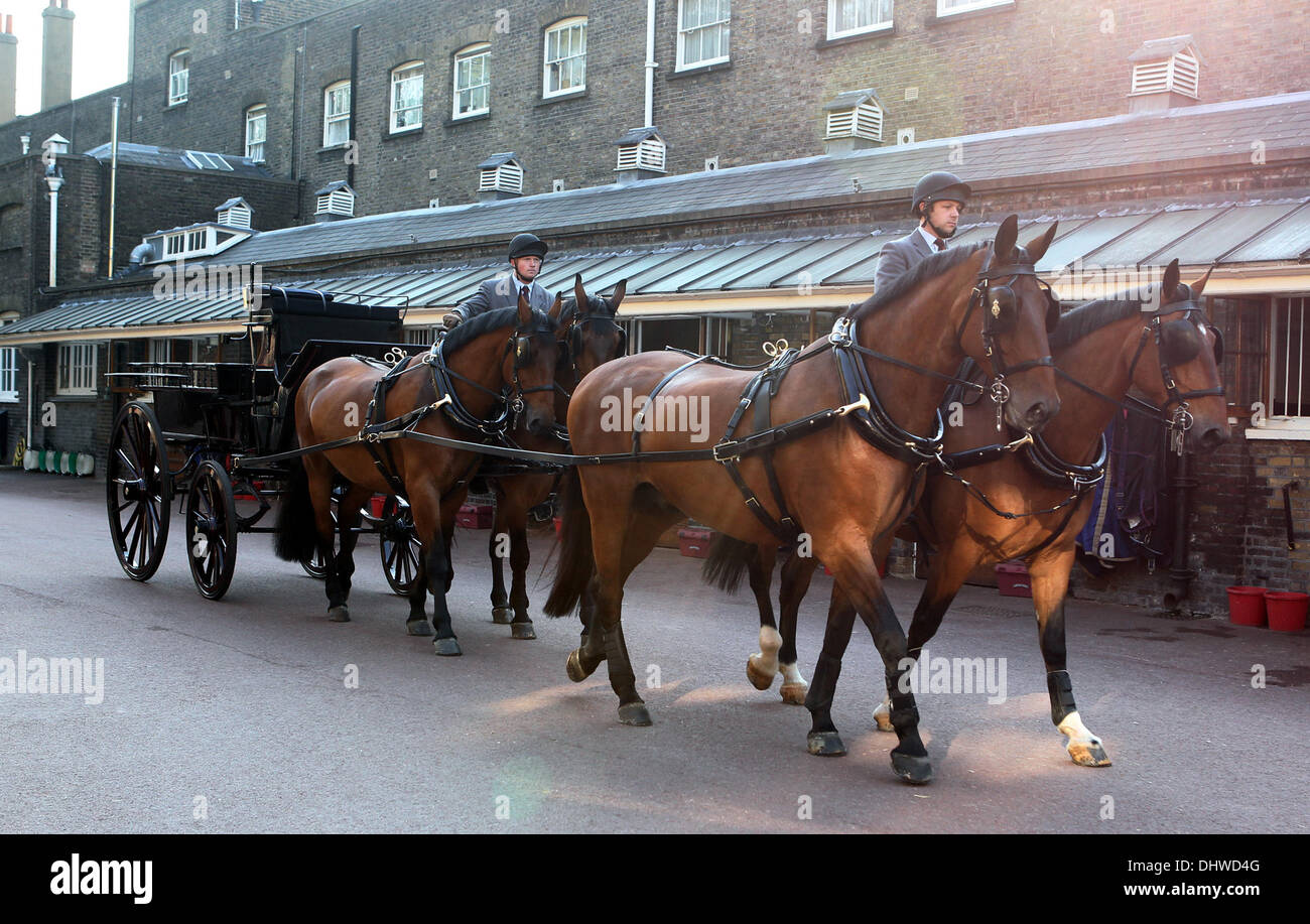 Coachmen prepare the horses at the Royal Mews in Buckingham Palace, as ...