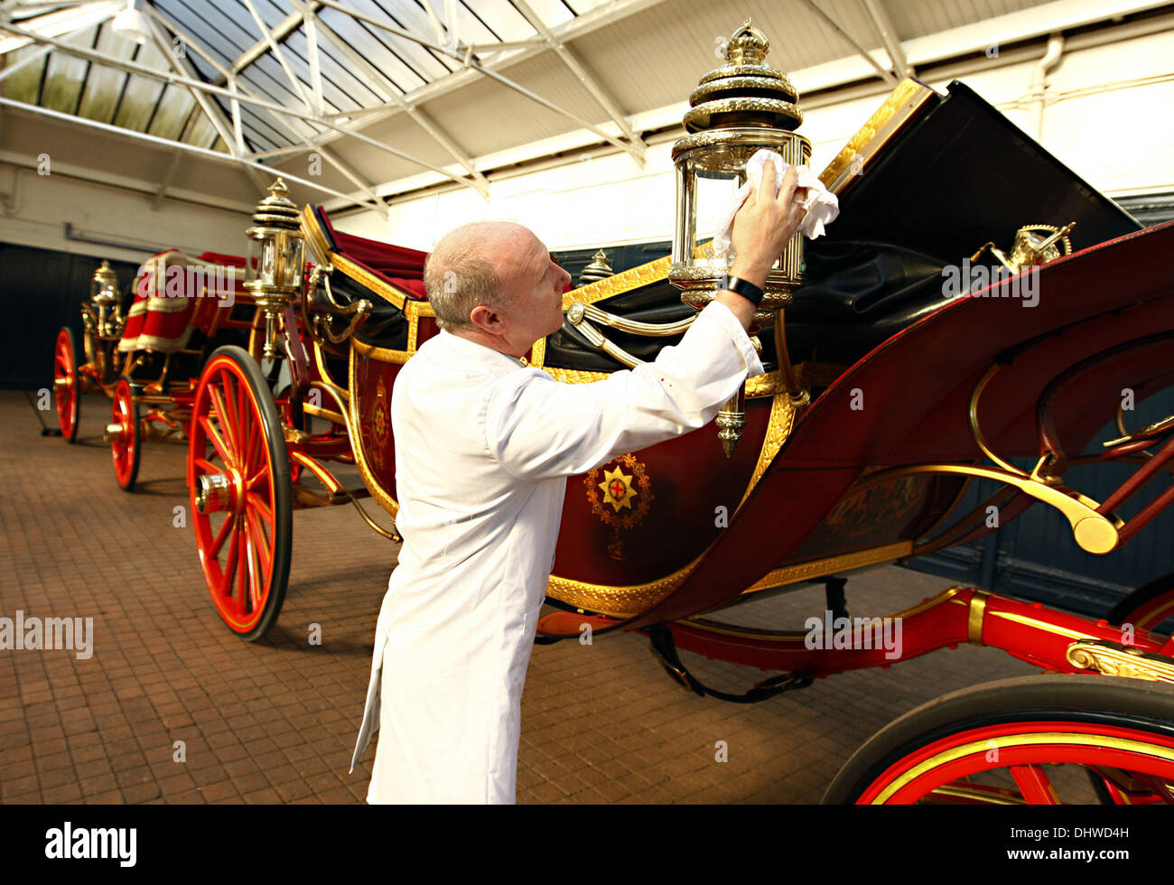 Carriage restorer David Evens cleans the 1902 State Landau carriage at ...