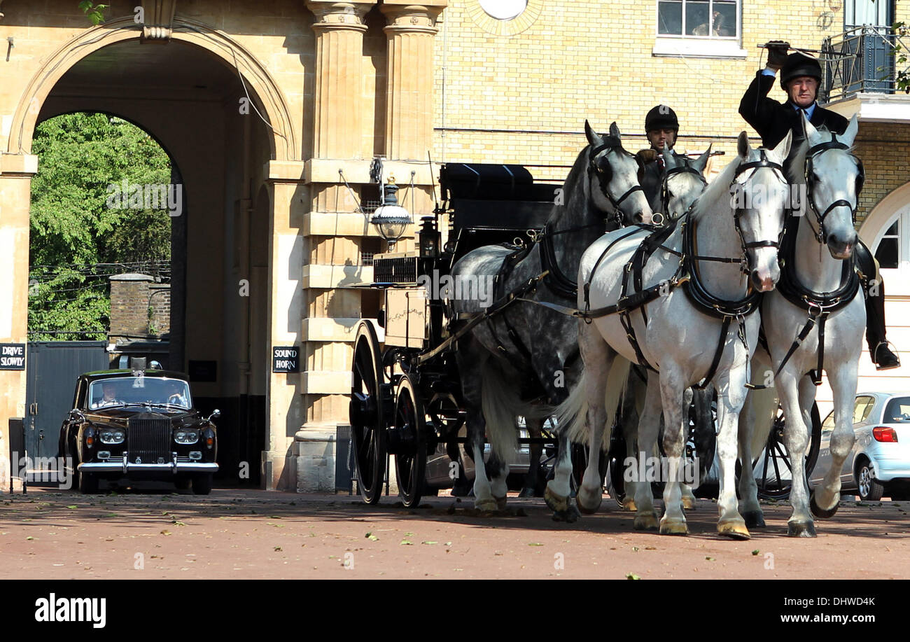 Coachmen prepare the horses at the Royal Mews in Buckingham Palace, as ...