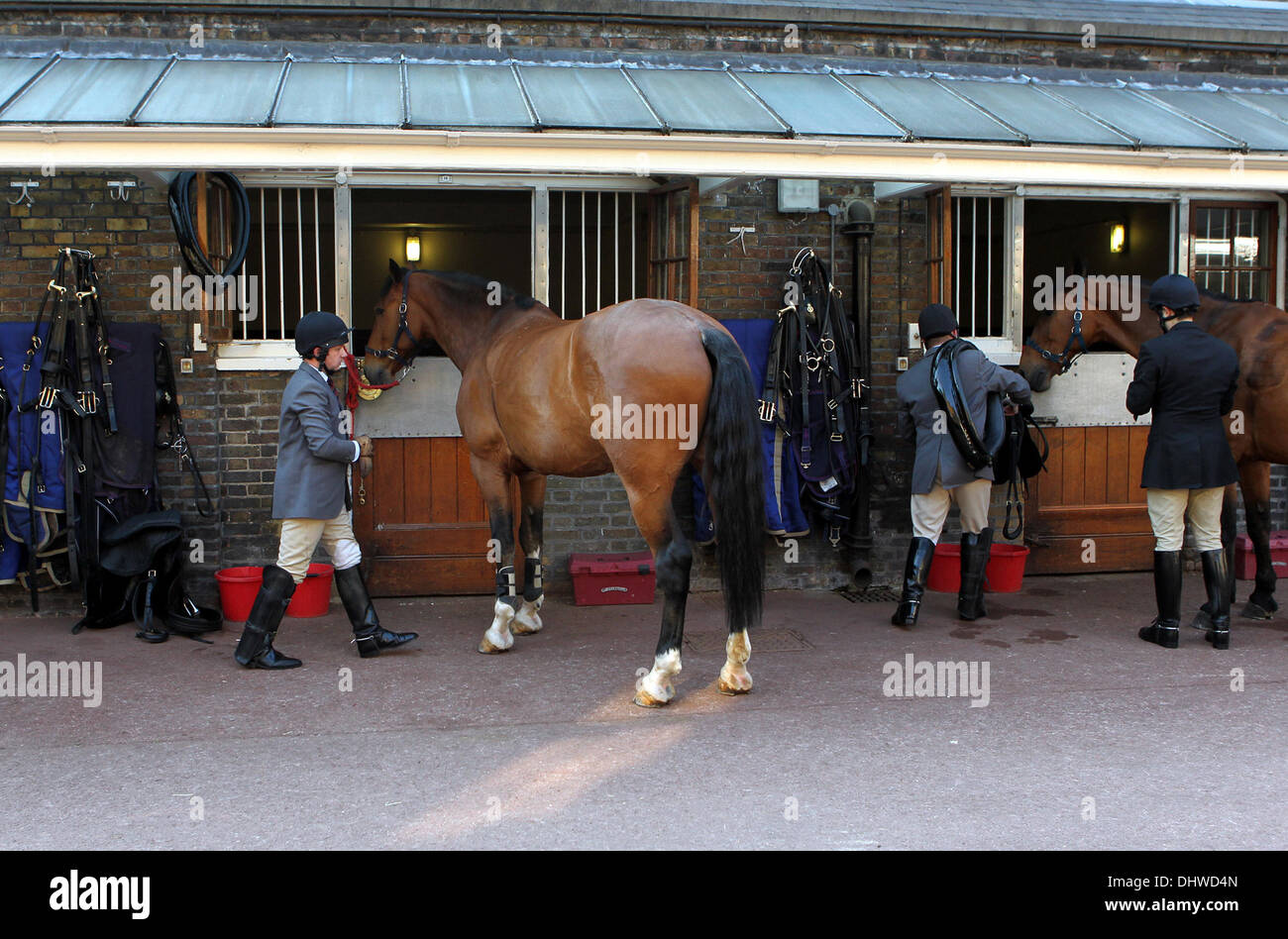 Coachmen prepare the horses at the Royal Mews in Buckingham Palace, as ...