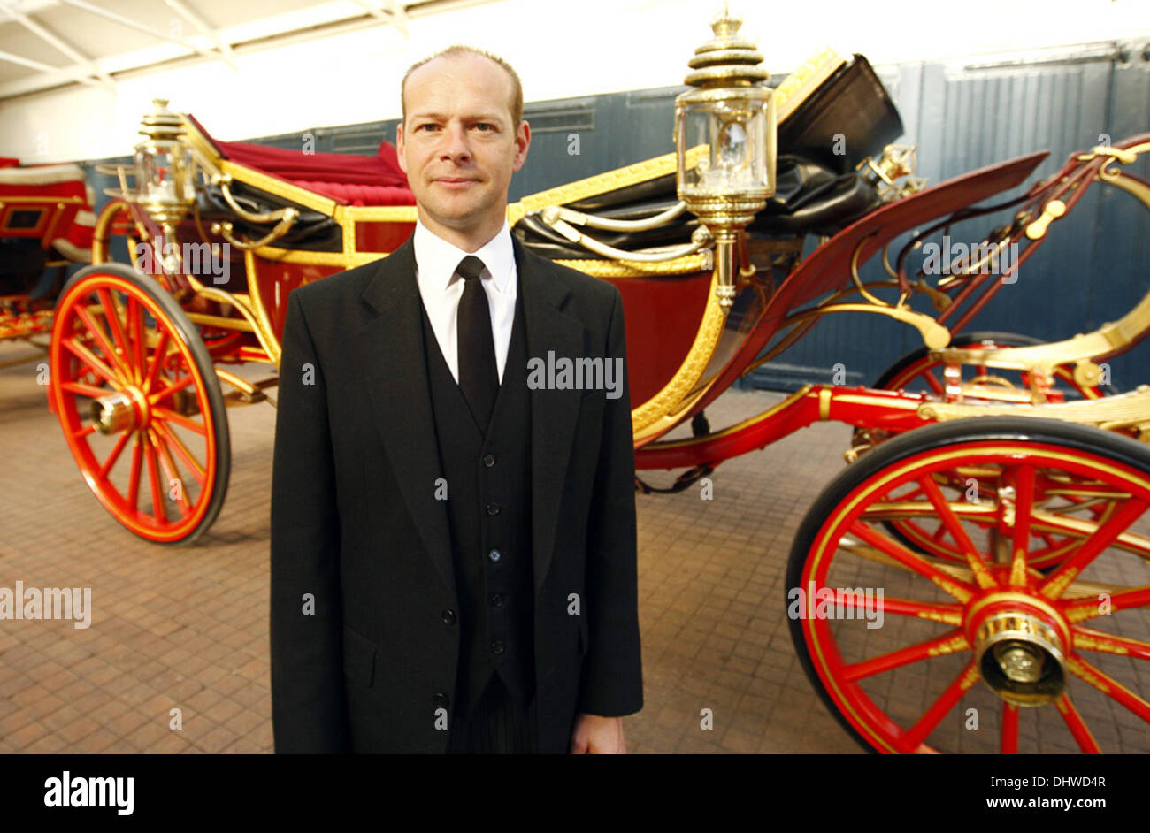 Head coachman Jack Hargreaves poses with the 1902 State Landau carriage ...