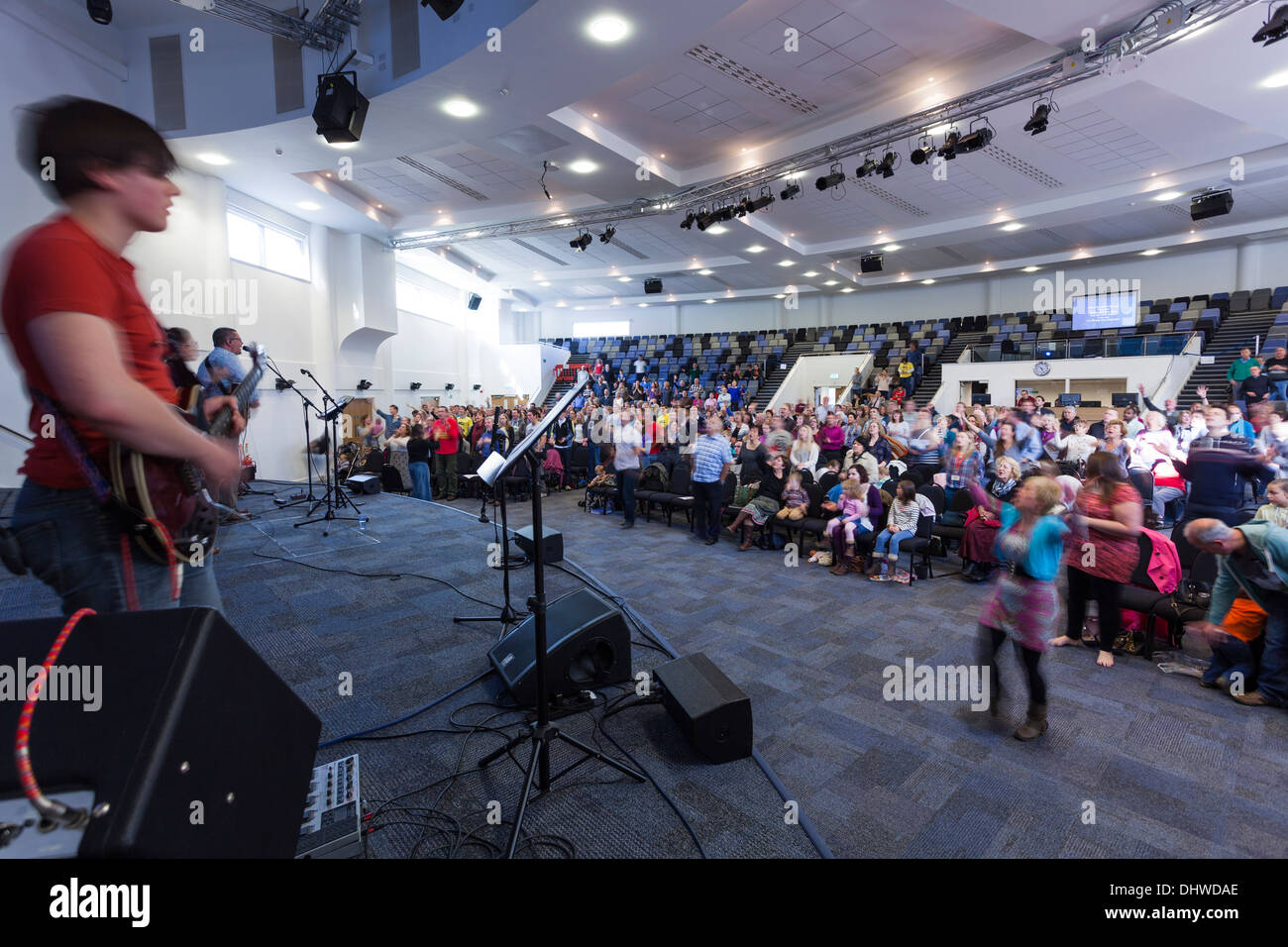 Congregation participating in contemporary worship music during Sunday ...
