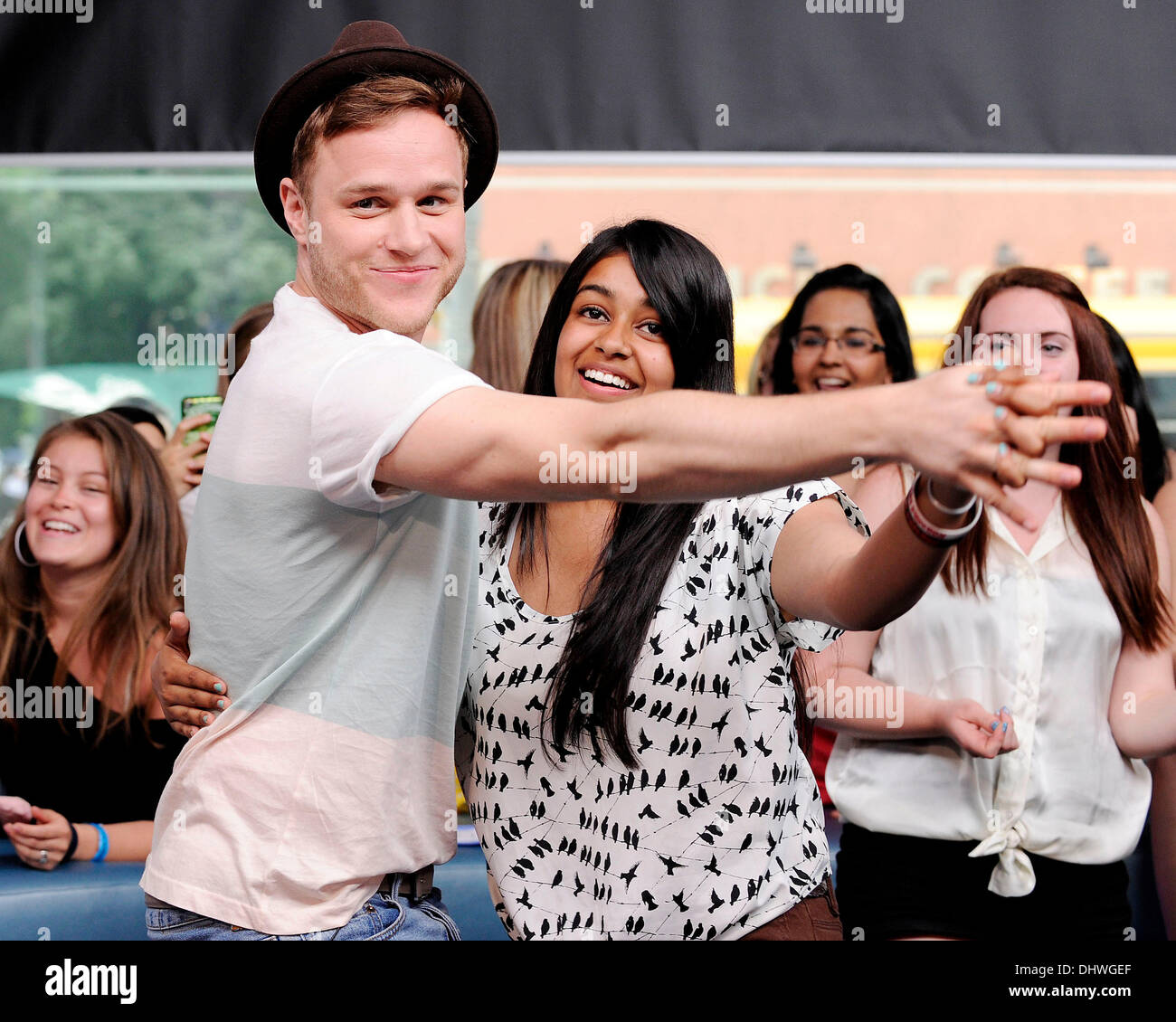 Olly Murs dances with a female fans during his appearance on MuchMusic ...