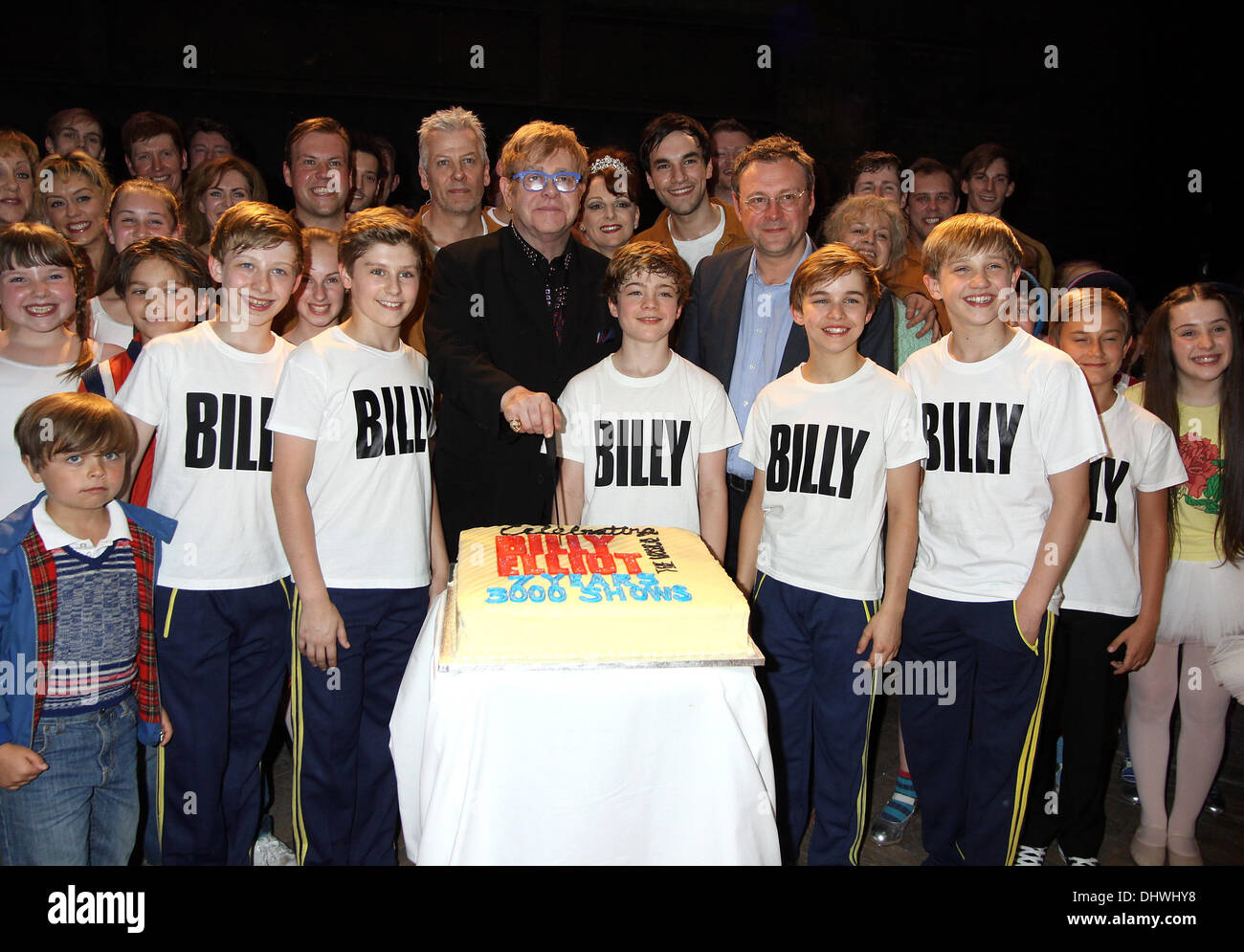 Sir Elton John and Lee Hall on stage with a cake and the cast of "Billy ...