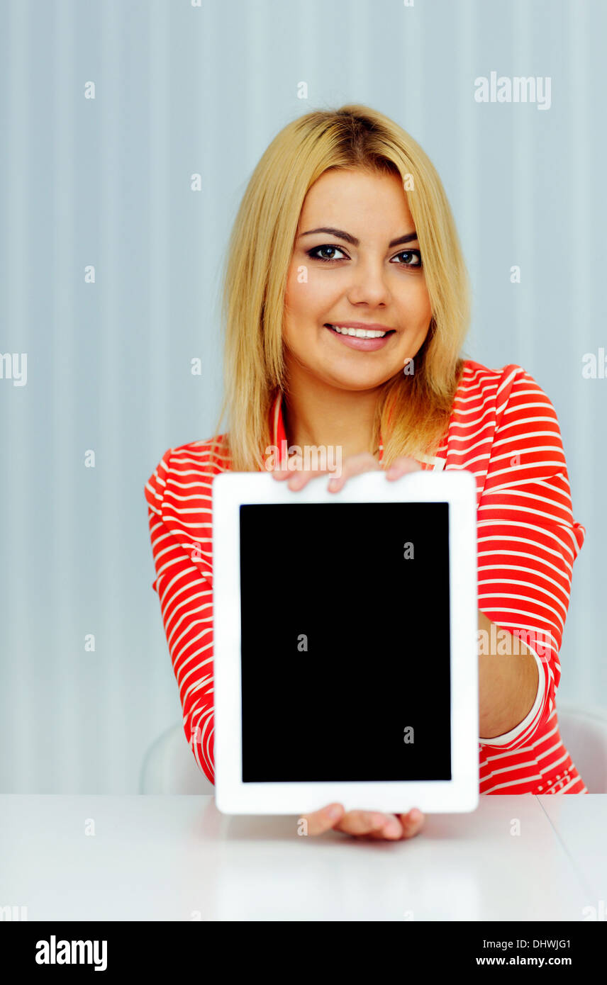 Young happy woman showing tablet computer display Stock Photo - Alamy