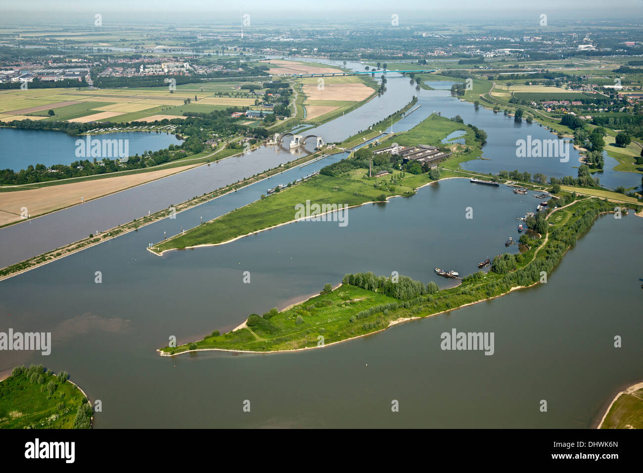 Netherlands, Hagestein. Weir and lock complex in Lek river. Flooded ...