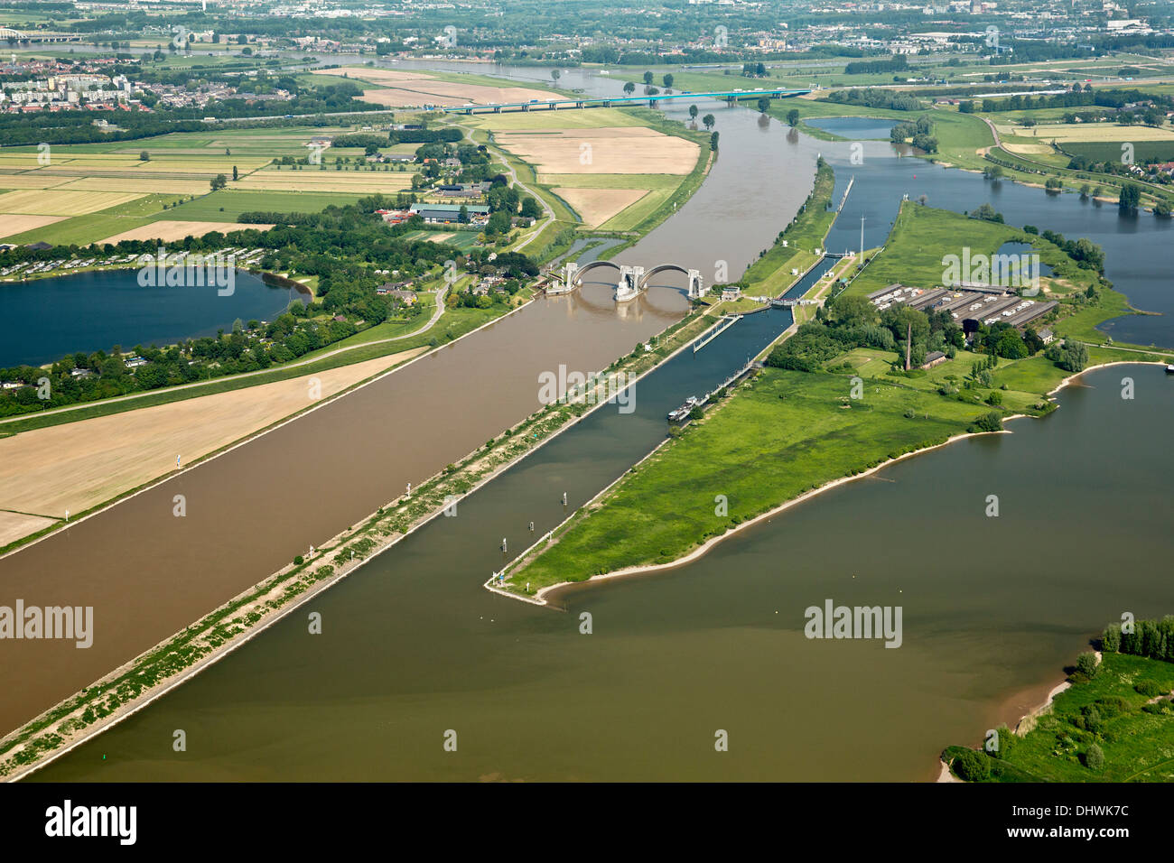 Netherlands, Hagestein. Weir and lock complex in Lek river. Flooded ...