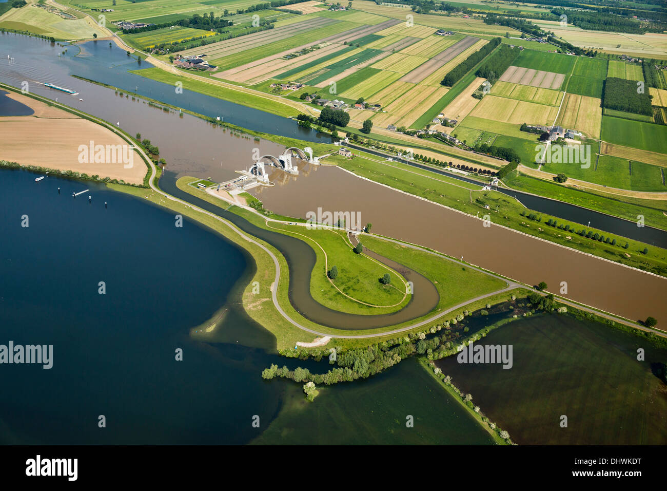 Netherlands, Amerongen. Weir and lock complex in Nederrijn river. Cargo ...