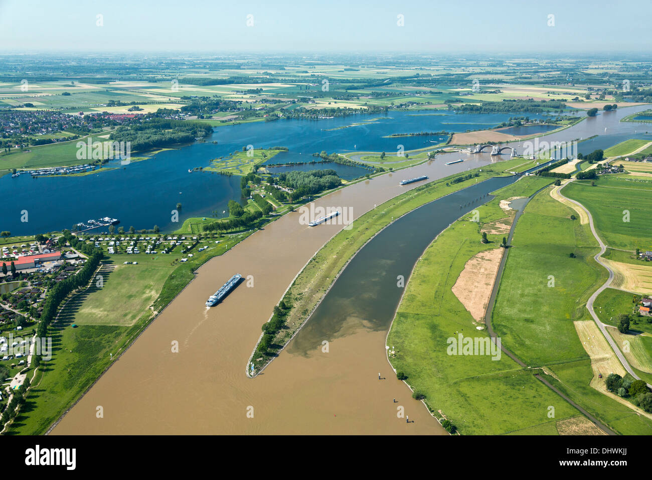 Netherlands, Amerongen. Weir and lock complex in Nederrijn river. Cargo ...