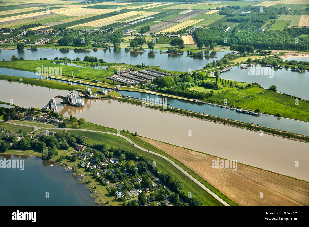 Netherlands, Hagestein. Weir and lock complex in Lek river. Flooded ...