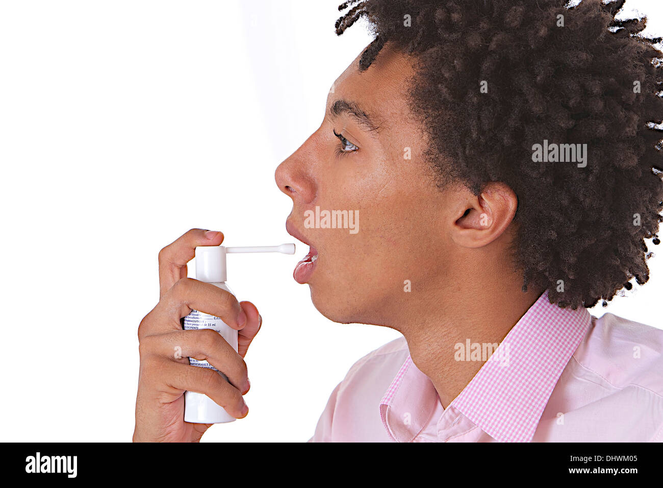 ADOLESCENT USING SPRAY IN MOUTH Stock Photo - Alamy