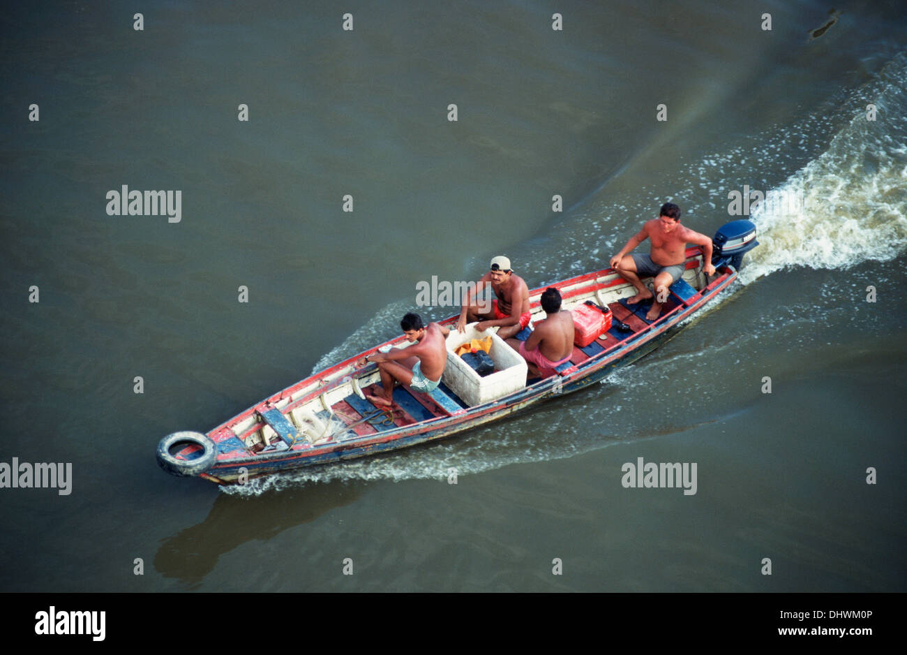 people on a canoe, rio negro, manaus, state of amazonas, amazon region ...