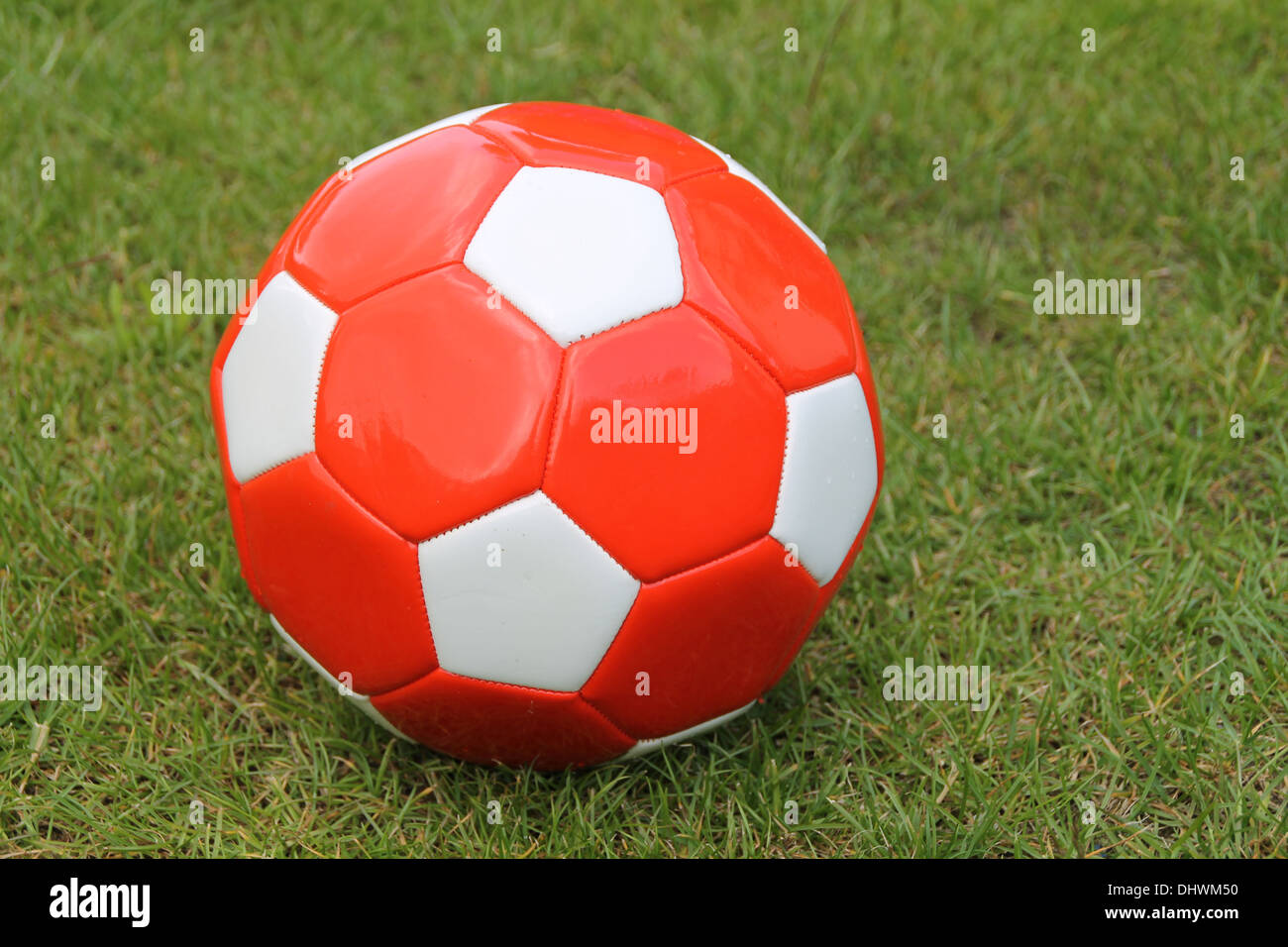 A red white football Stock Photo - Alamy