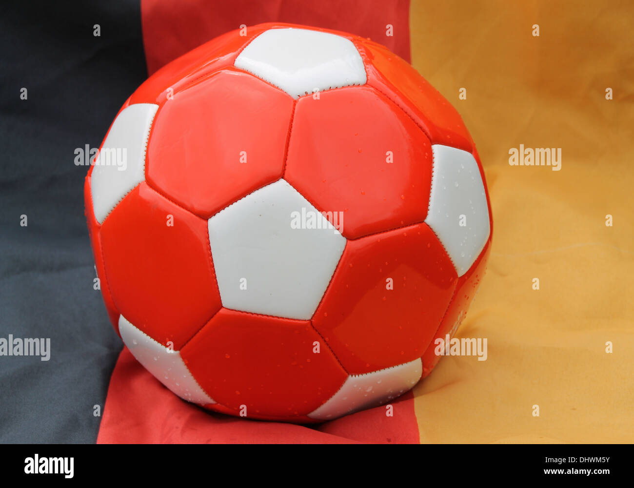 A german flag with a red ball Stock Photo - Alamy