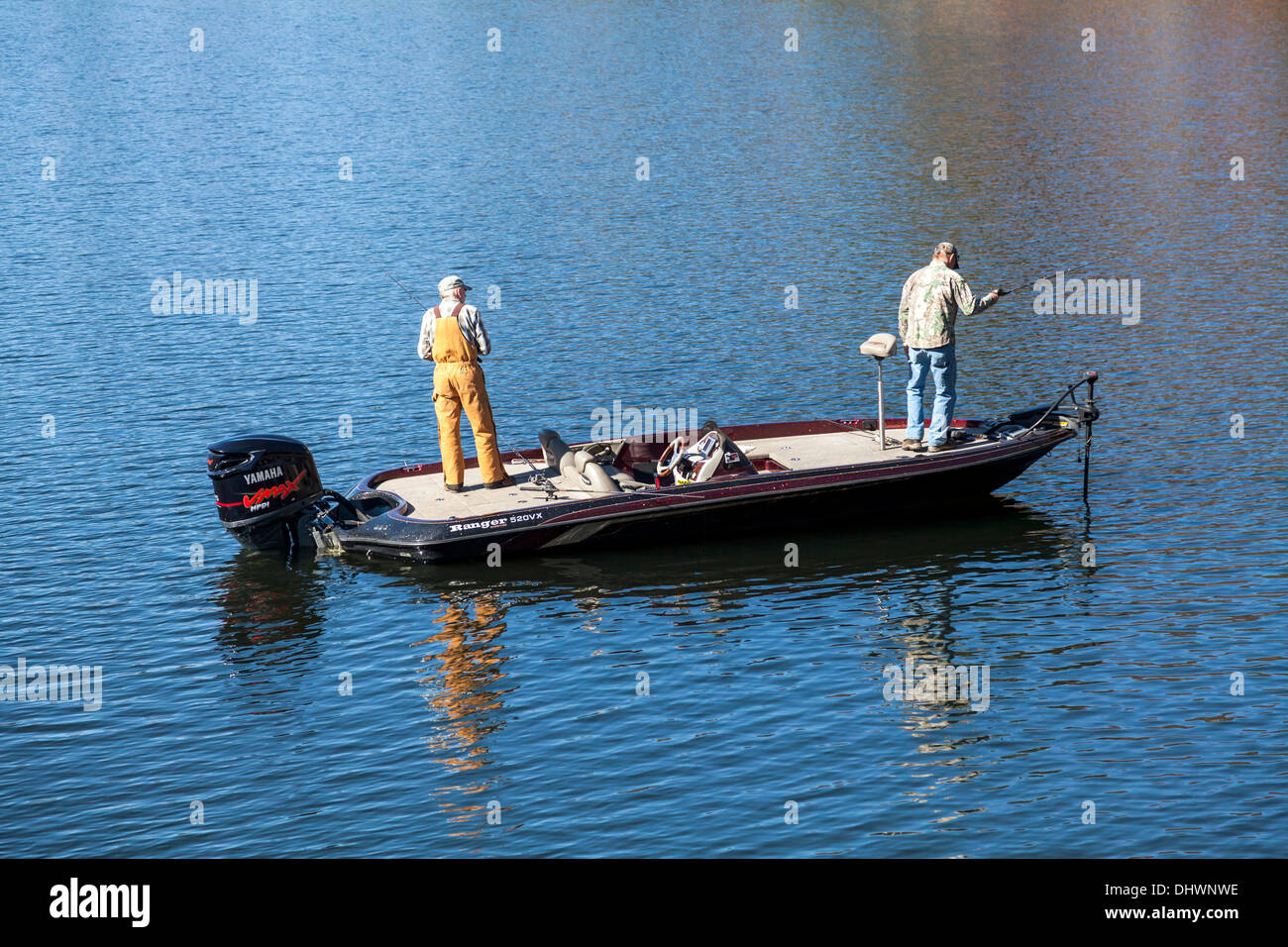 Two fishermen standing on a fishing boat on Lake Glenville near ...