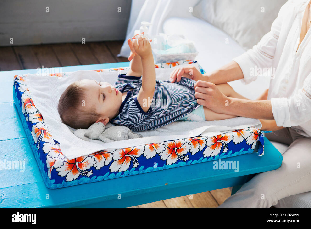 Baby mother change clothes diaper hi-res stock photography and images ...