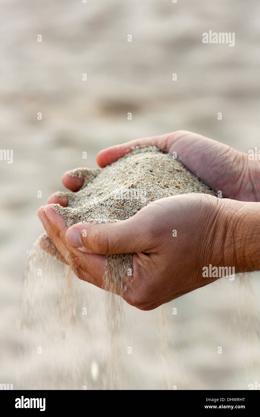 Man hands holding spilling sand hi-res stock photography and images - Alamy