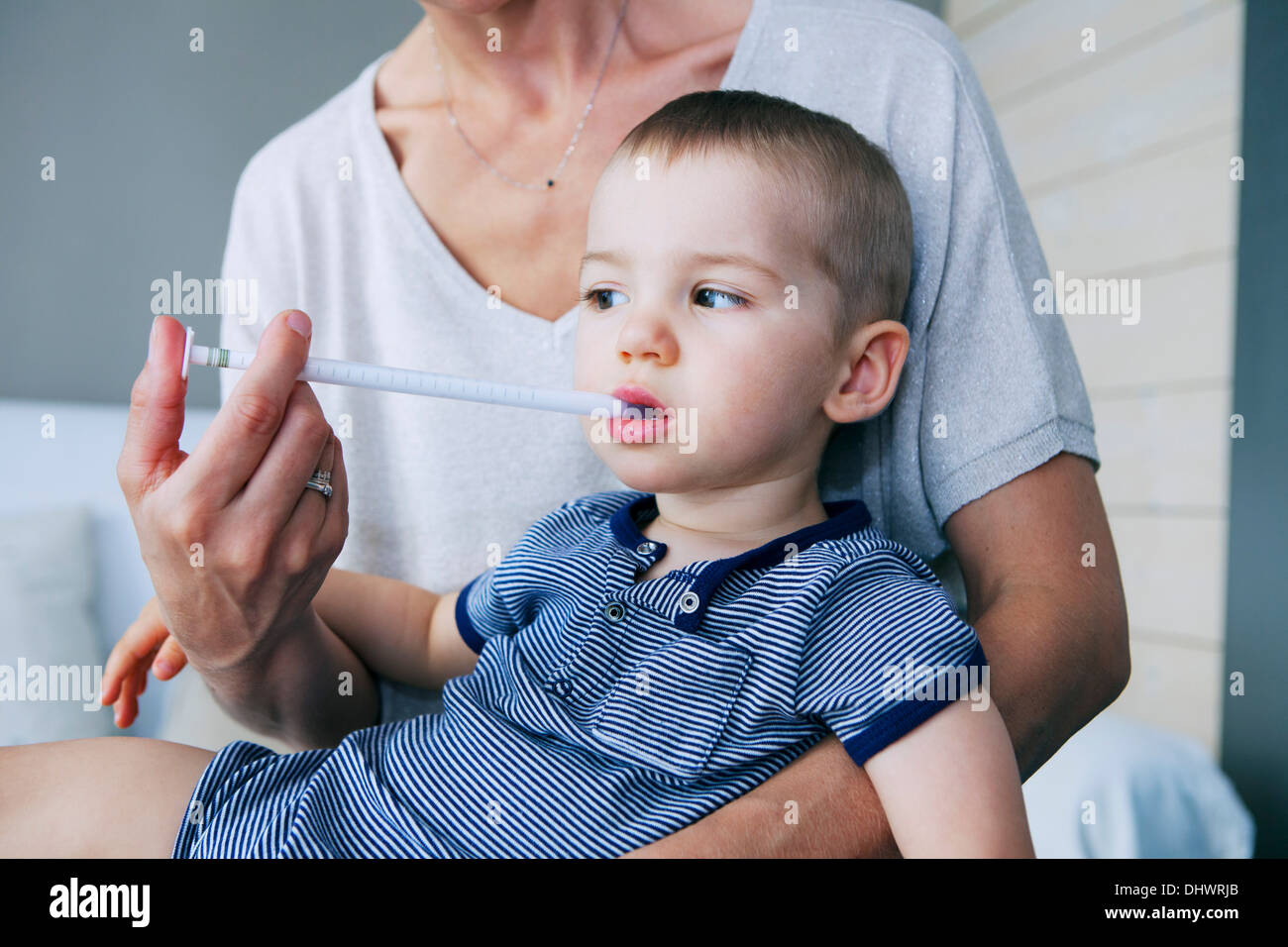 Her child taking hi-res stock photography and images - Alamy