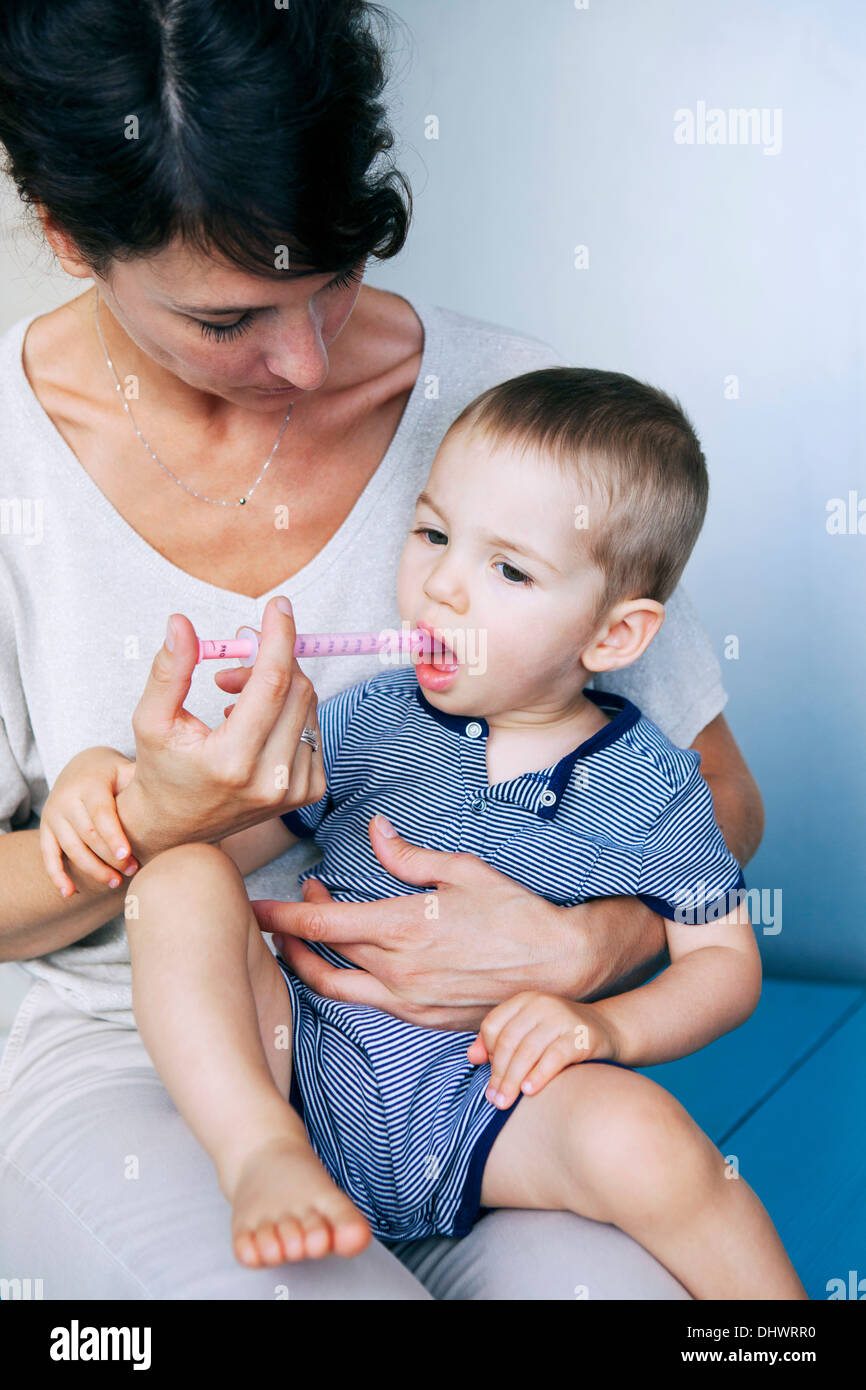 CHILD TAKING MEDICATION Stock Photo - Alamy