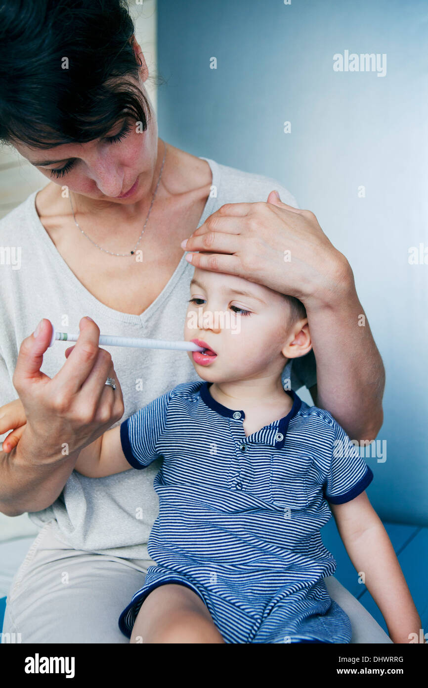 CHILD TAKING MEDICATION Stock Photo - Alamy