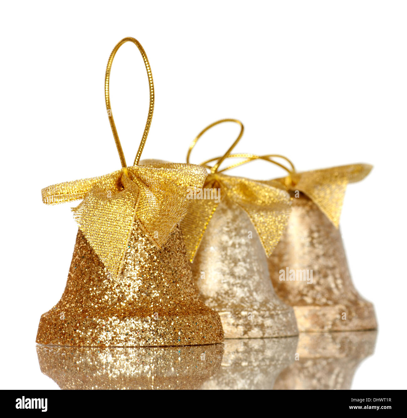 Golden Christmas Jingle Bells on white background with reflection Stock ...