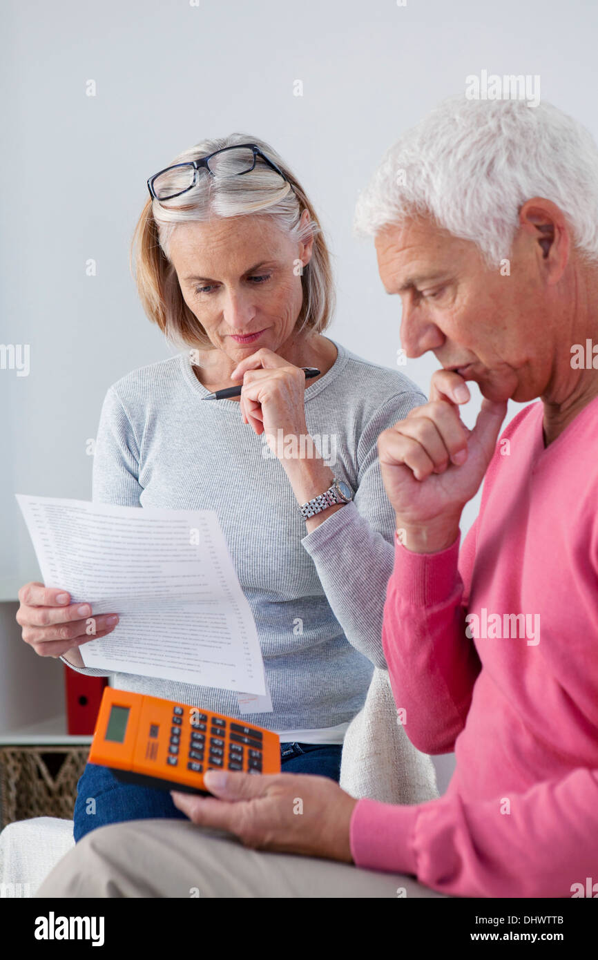 COUPLE DOING PAPERWORK Stock Photo - Alamy