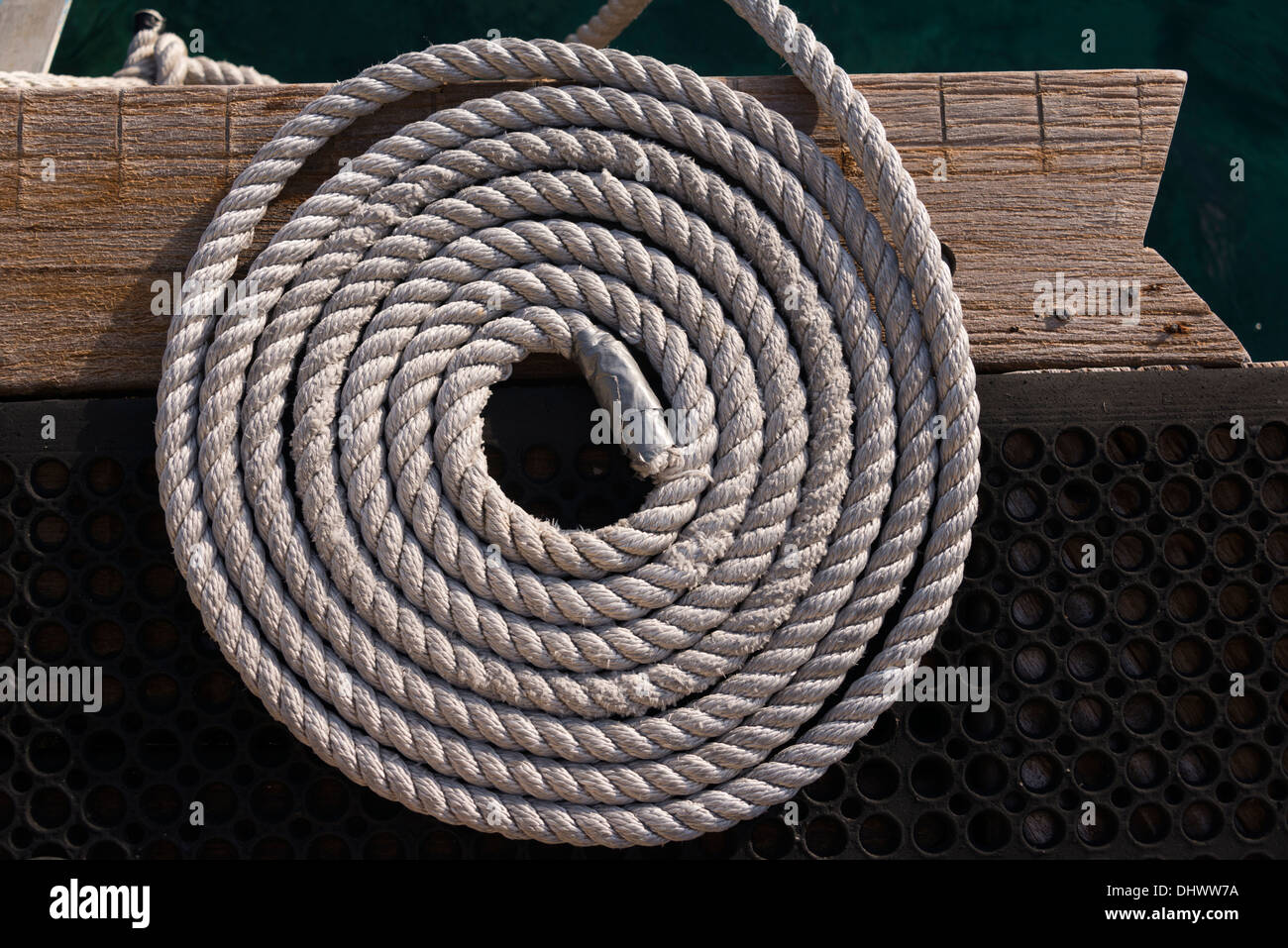 Marine mooring rope coiled on a dive centre jetty, Bonaire, Netherlands ...