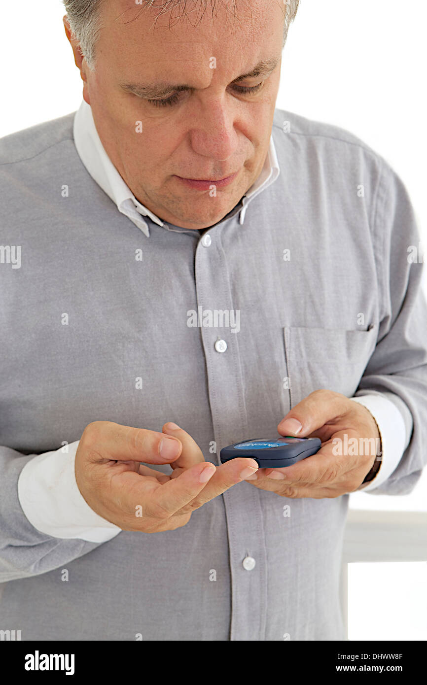 TEST FOR DIABETES ELDERLY PERSON Stock Photo - Alamy