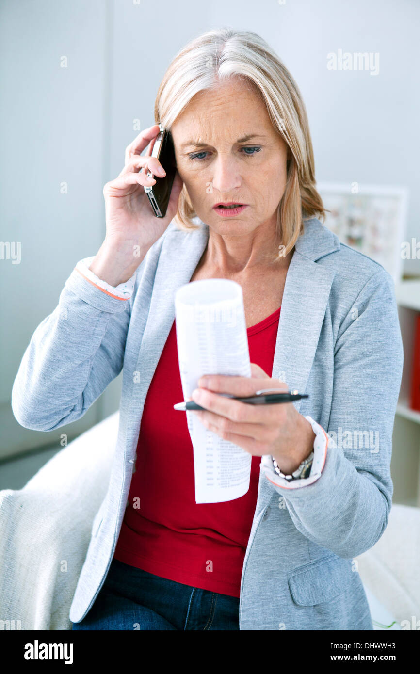 SENIOR DOING PAPERWORK Stock Photo - Alamy