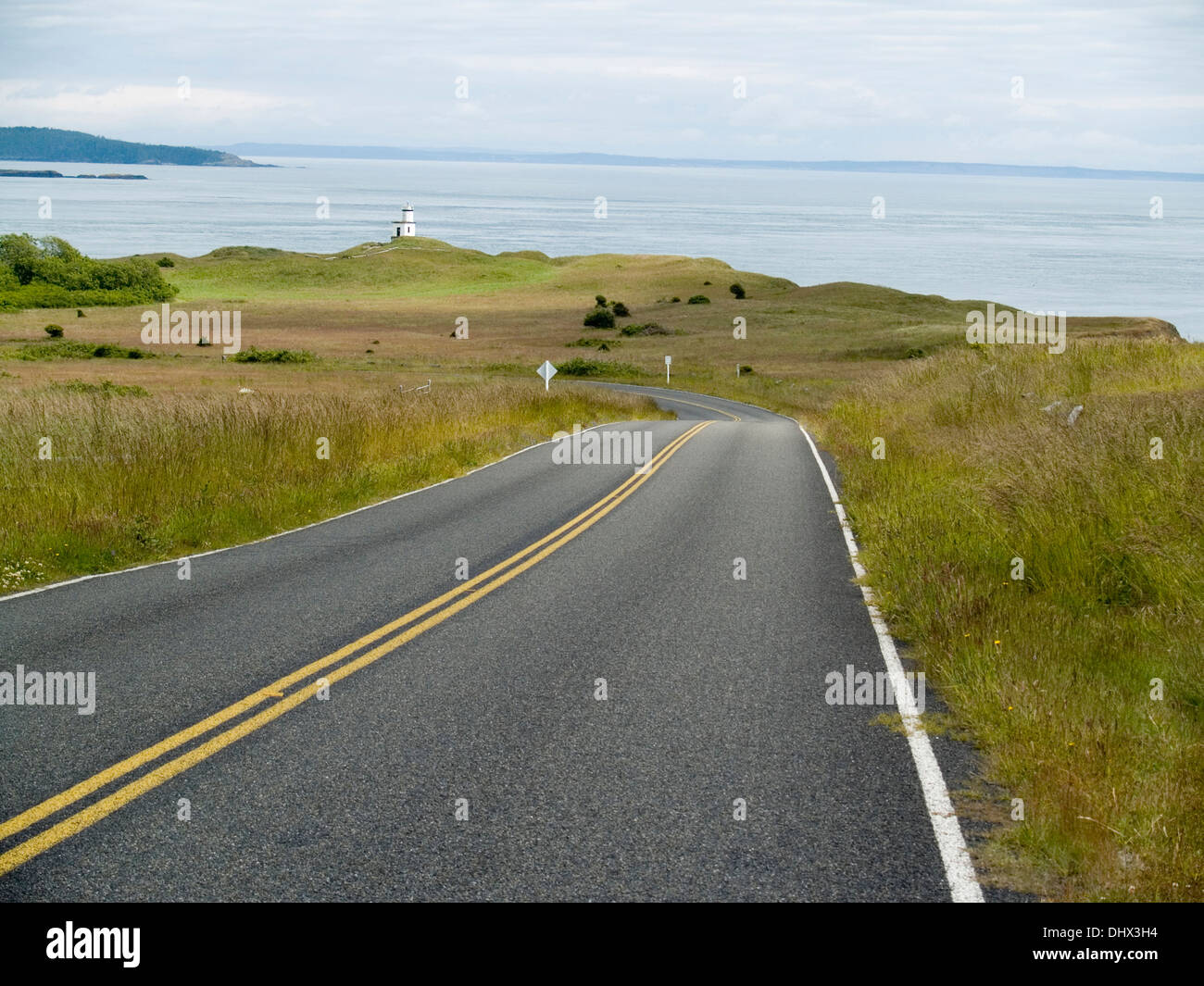 A local road points the way to the Cattle Point Lighthouse on San Juan ...