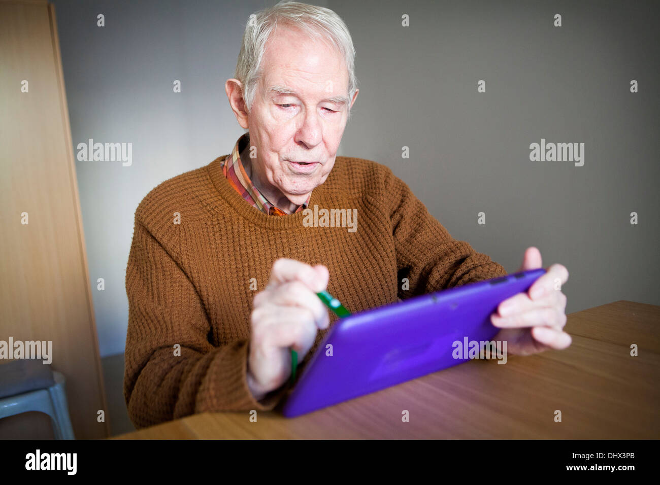 ELDERLY PERSON WITH TABLET Stock Photo - Alamy