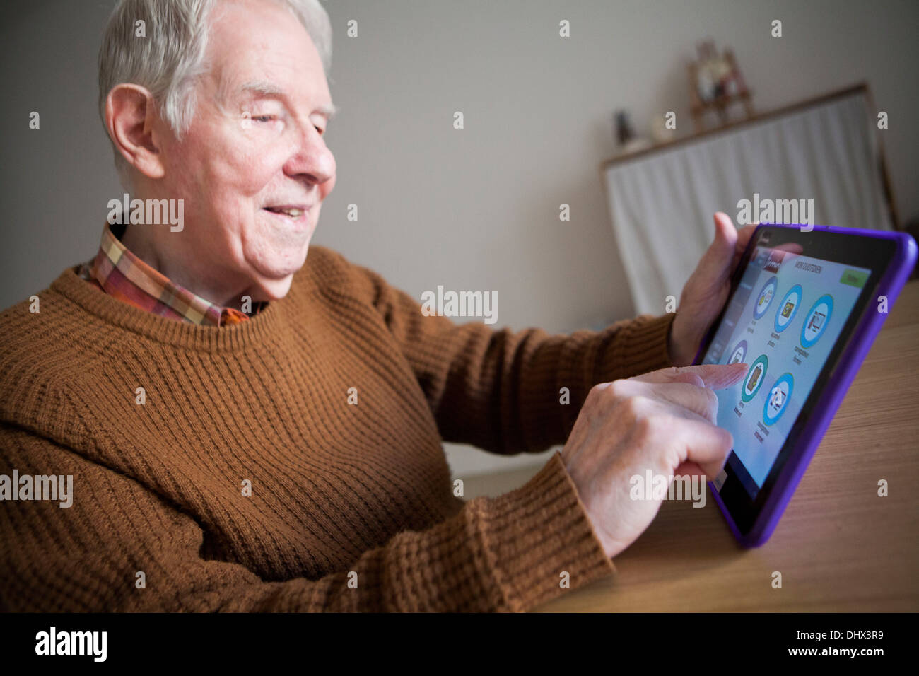 ELDERLY PERSON WITH TABLET Stock Photo - Alamy