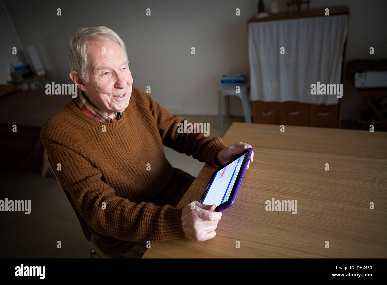 ELDERLY PERSON WITH TABLET Stock Photo - Alamy