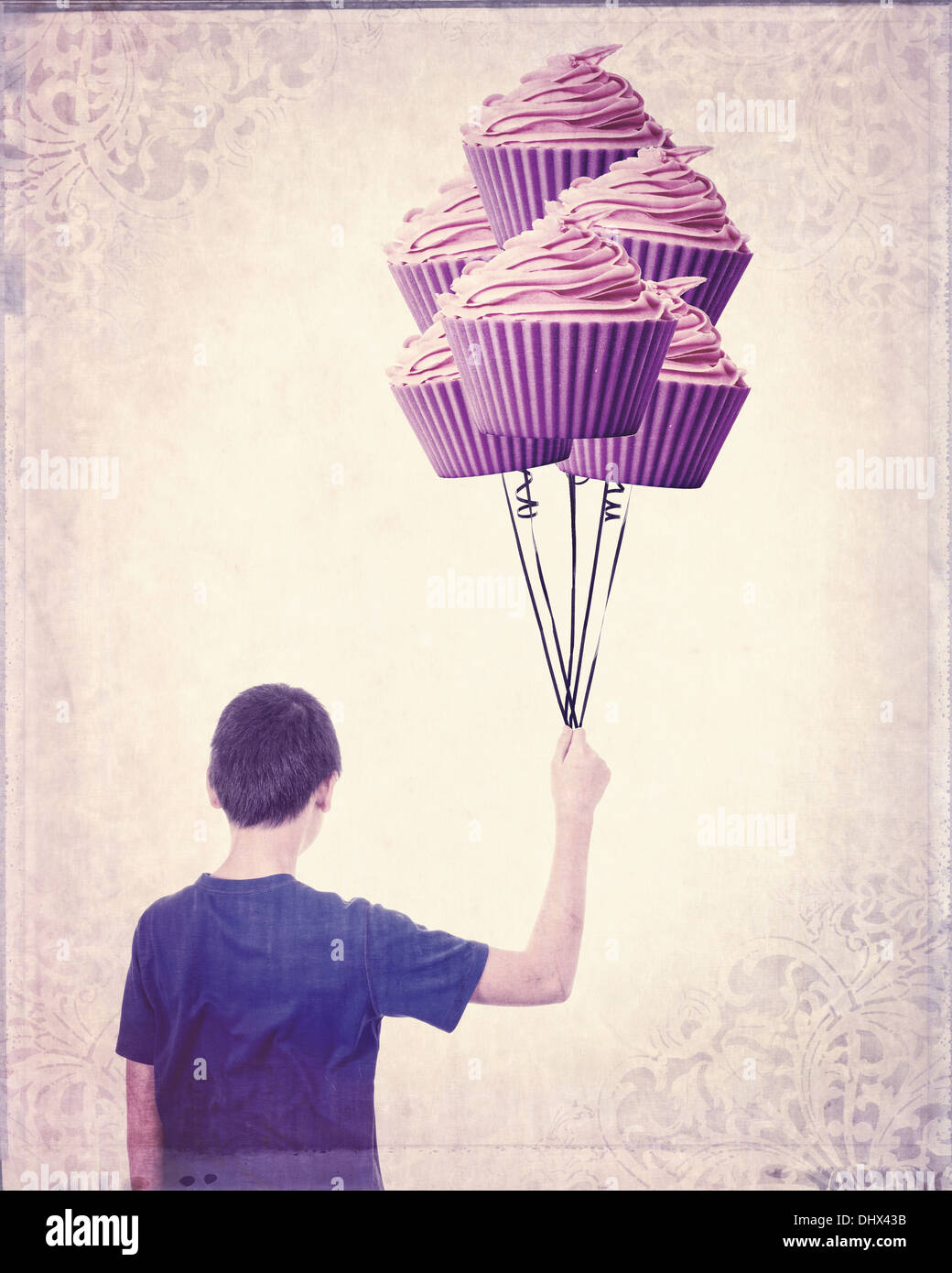 A boy holds a bunch of floating cupcakes Stock Photo - Alamy