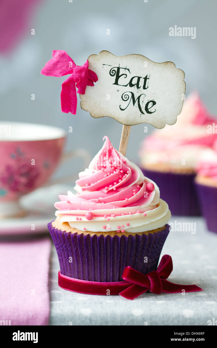Cupcake with "Eat Me" pick Stock Photo - Alamy