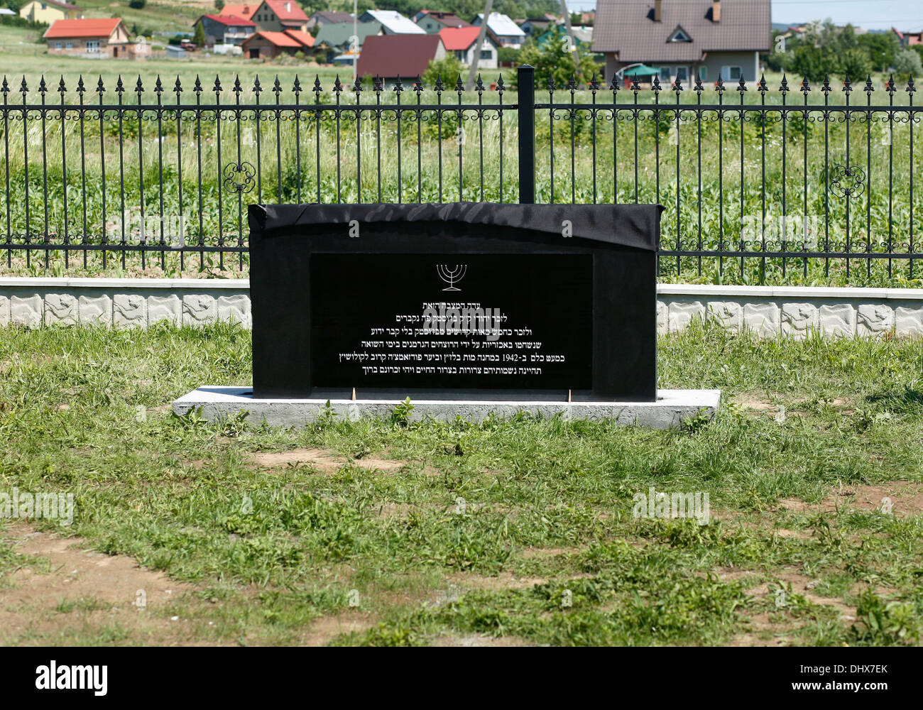 Hebrew inscription on memorial stone in re-consecrated Jewish cemetery ...