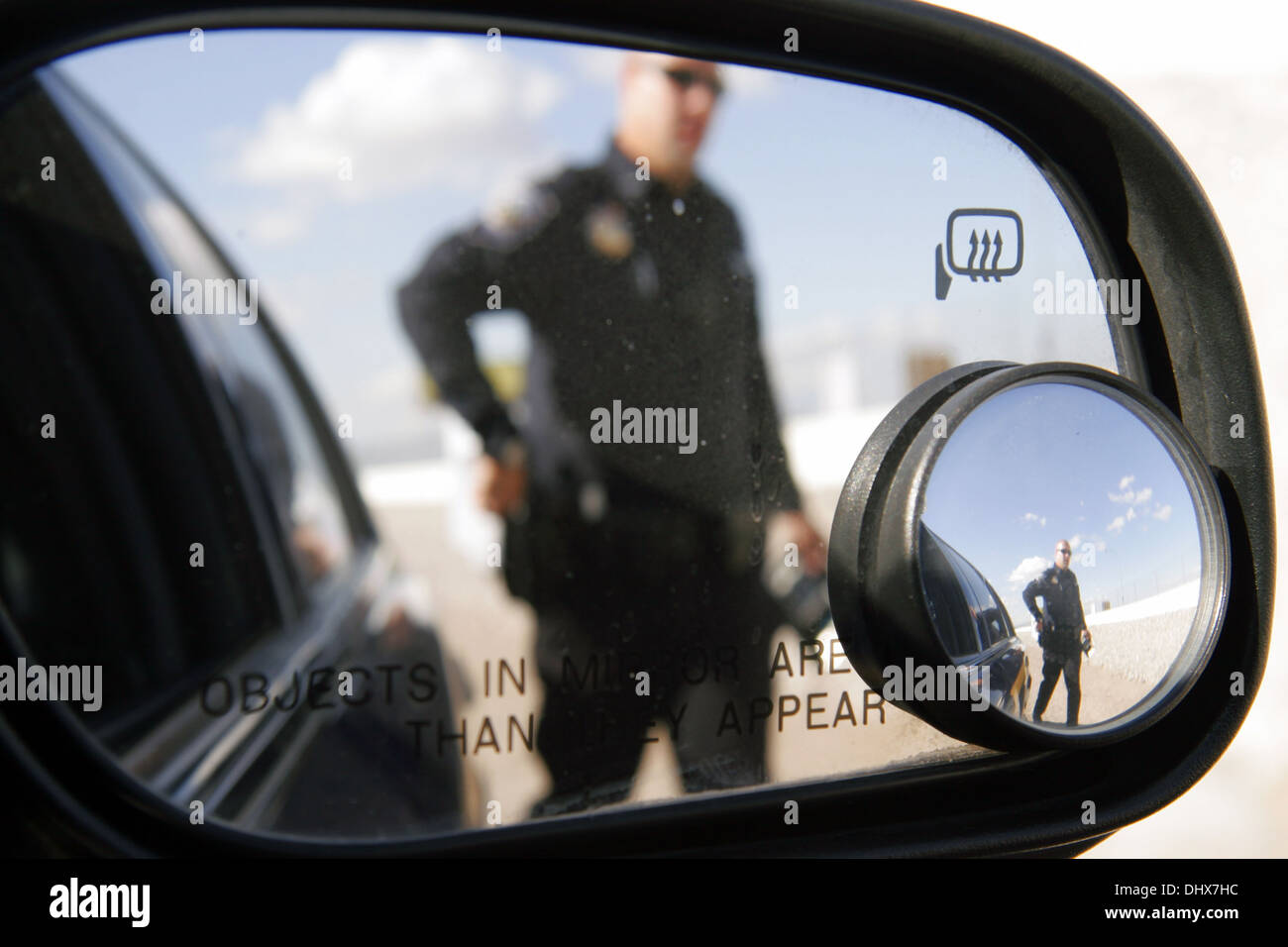 Nevada State Trooper Highway Patrol officer in wing mirror of car, Las ...