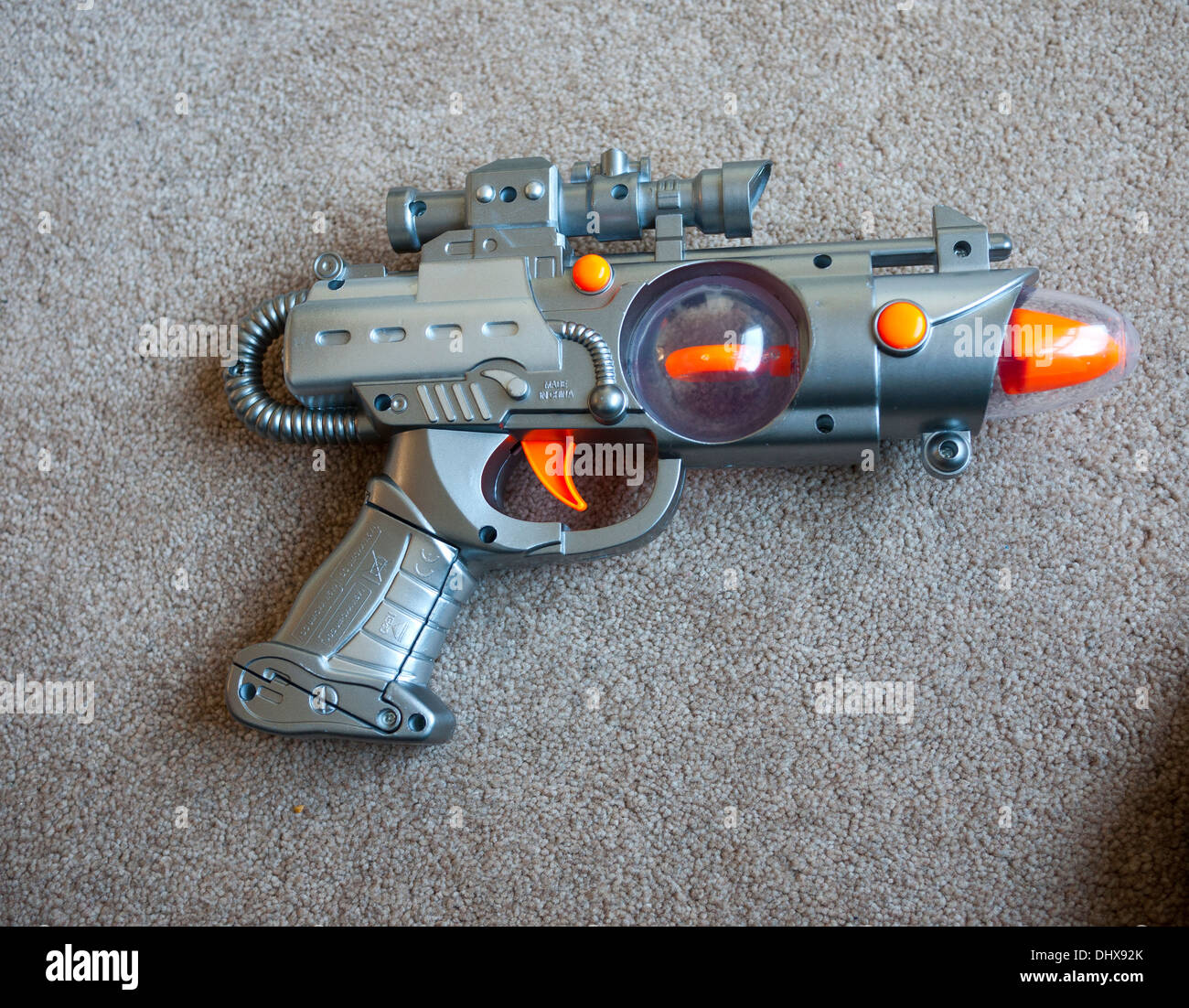 Toy space gun on carpet Stock Photo - Alamy