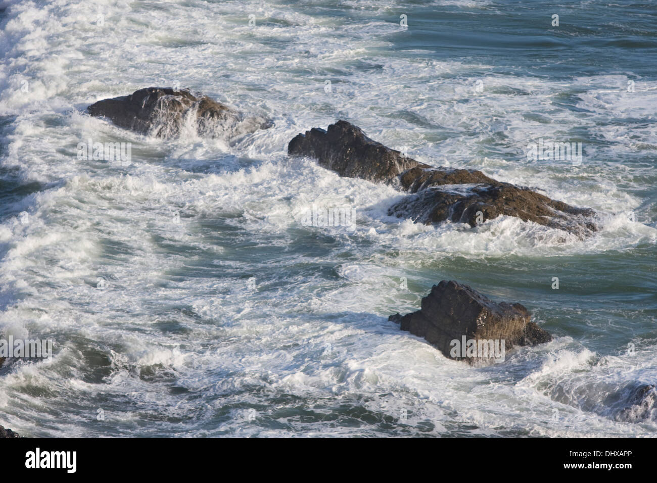 Surf crashing against rocks off Crescent Beach, as seen from Ecola ...