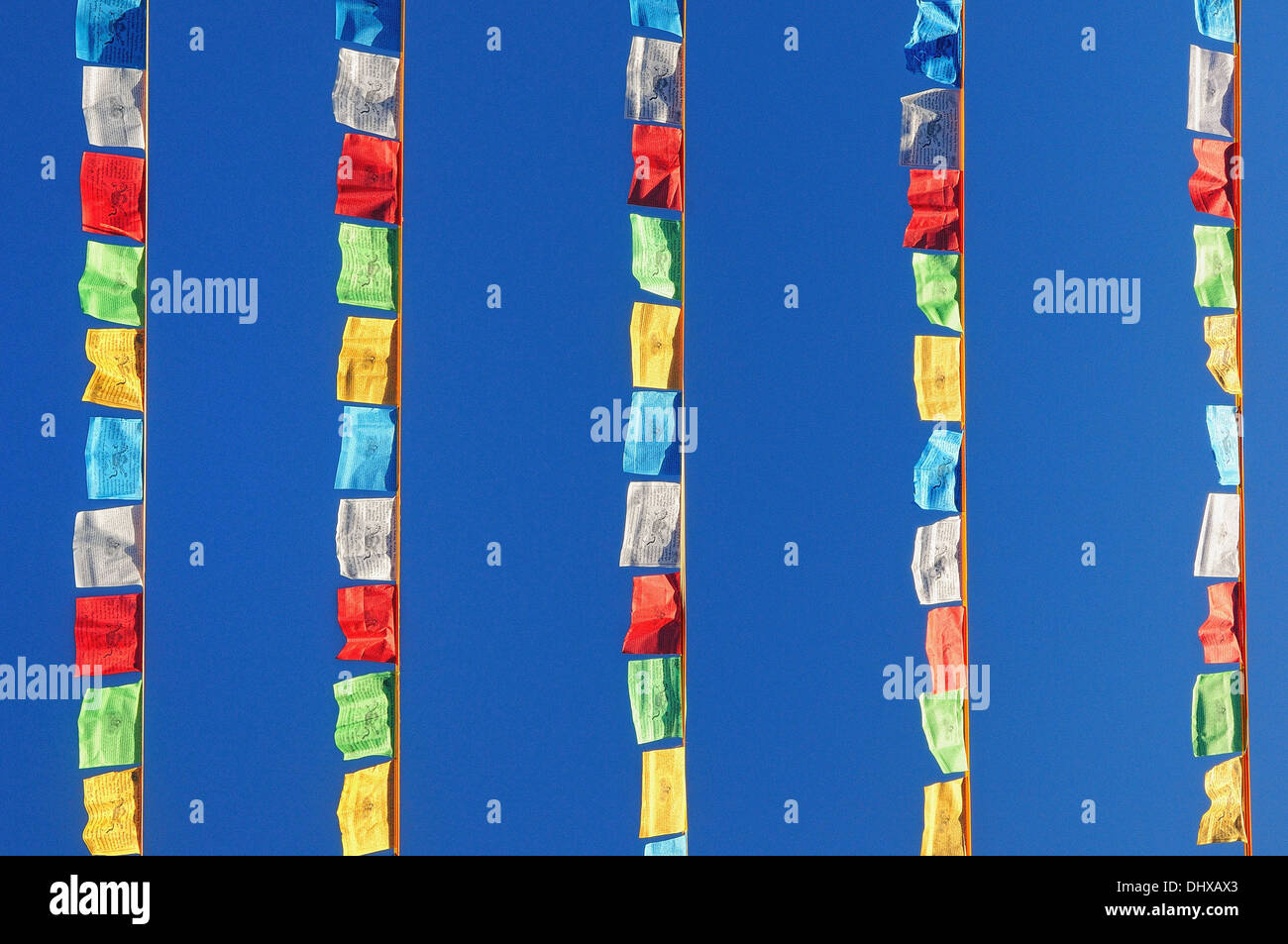 Prayer flags in the blue sky Stock Photo - Alamy