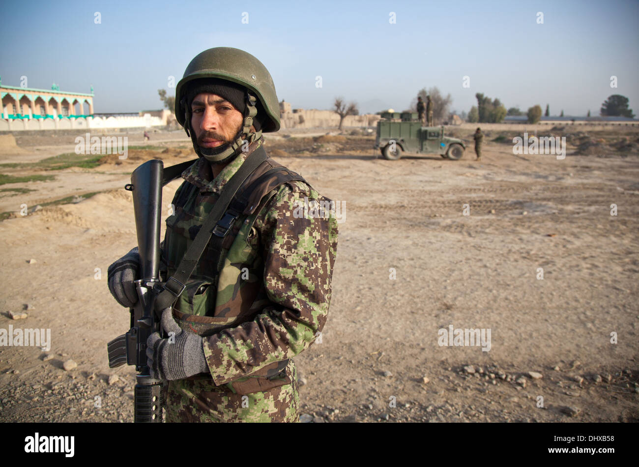 An Afghan soldier provides security during a patrol in a village March ...