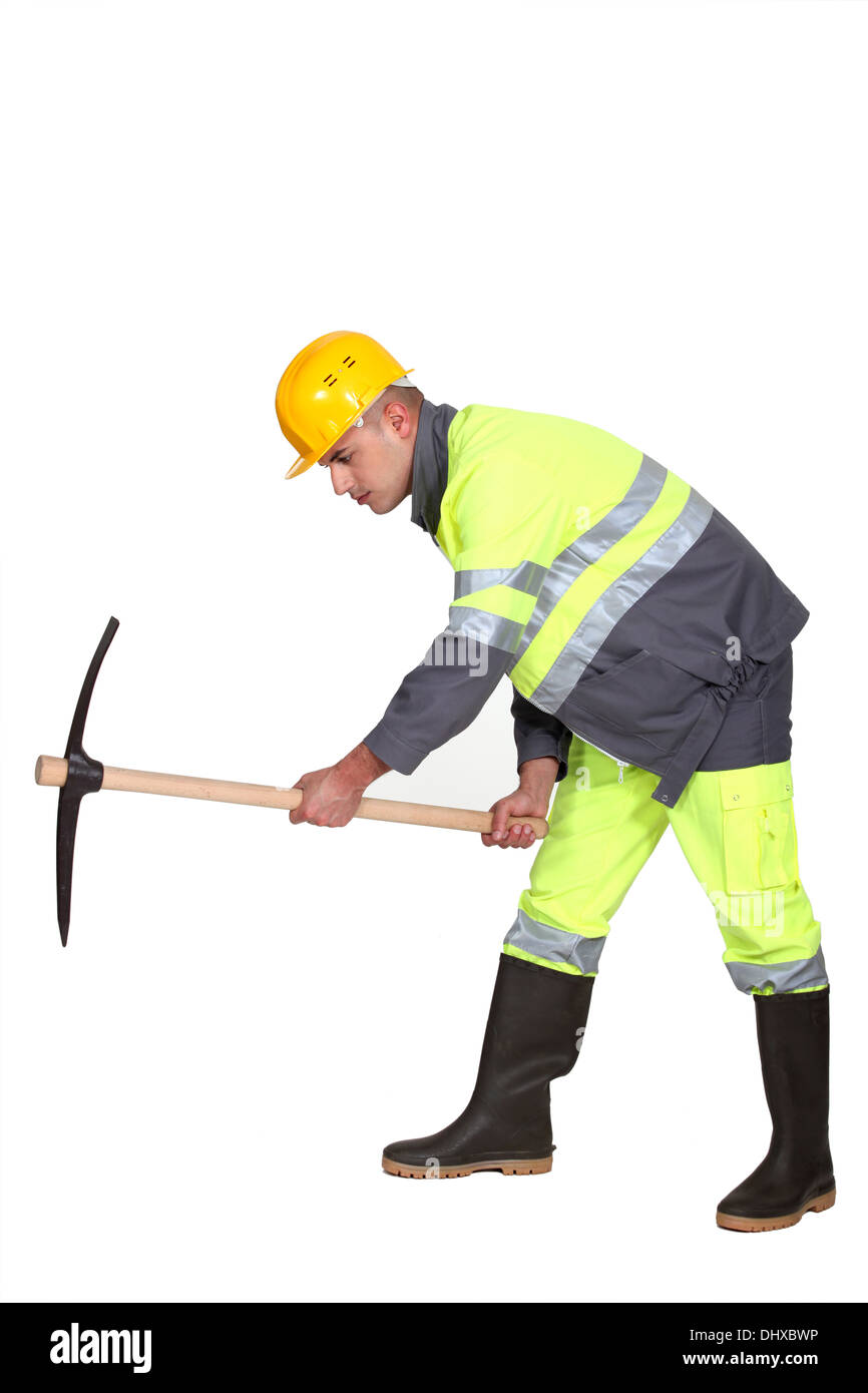 worker with a pickaxe Stock Photo - Alamy
