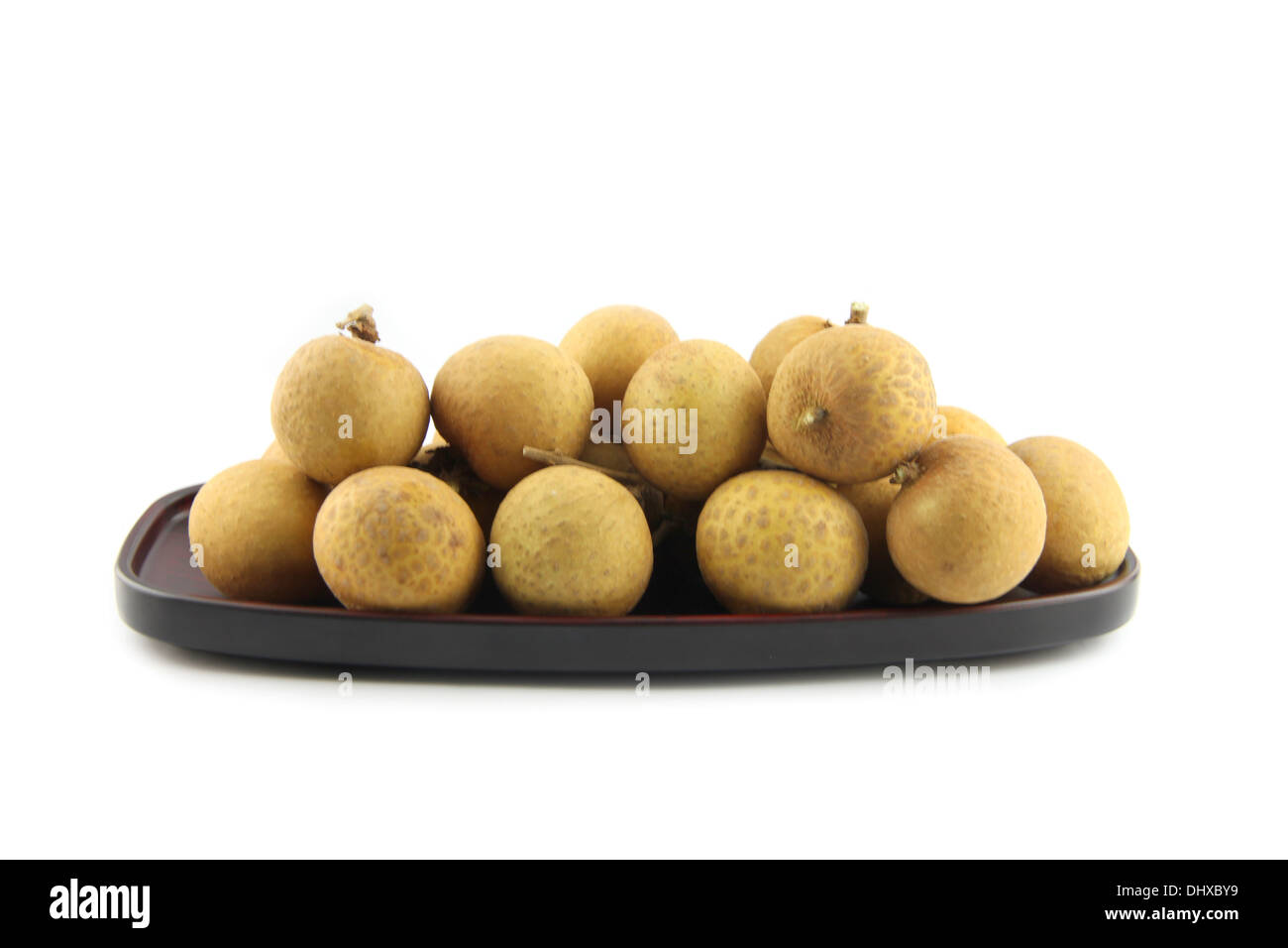 Closeup Longan in dish on white background Stock Photo - Alamy