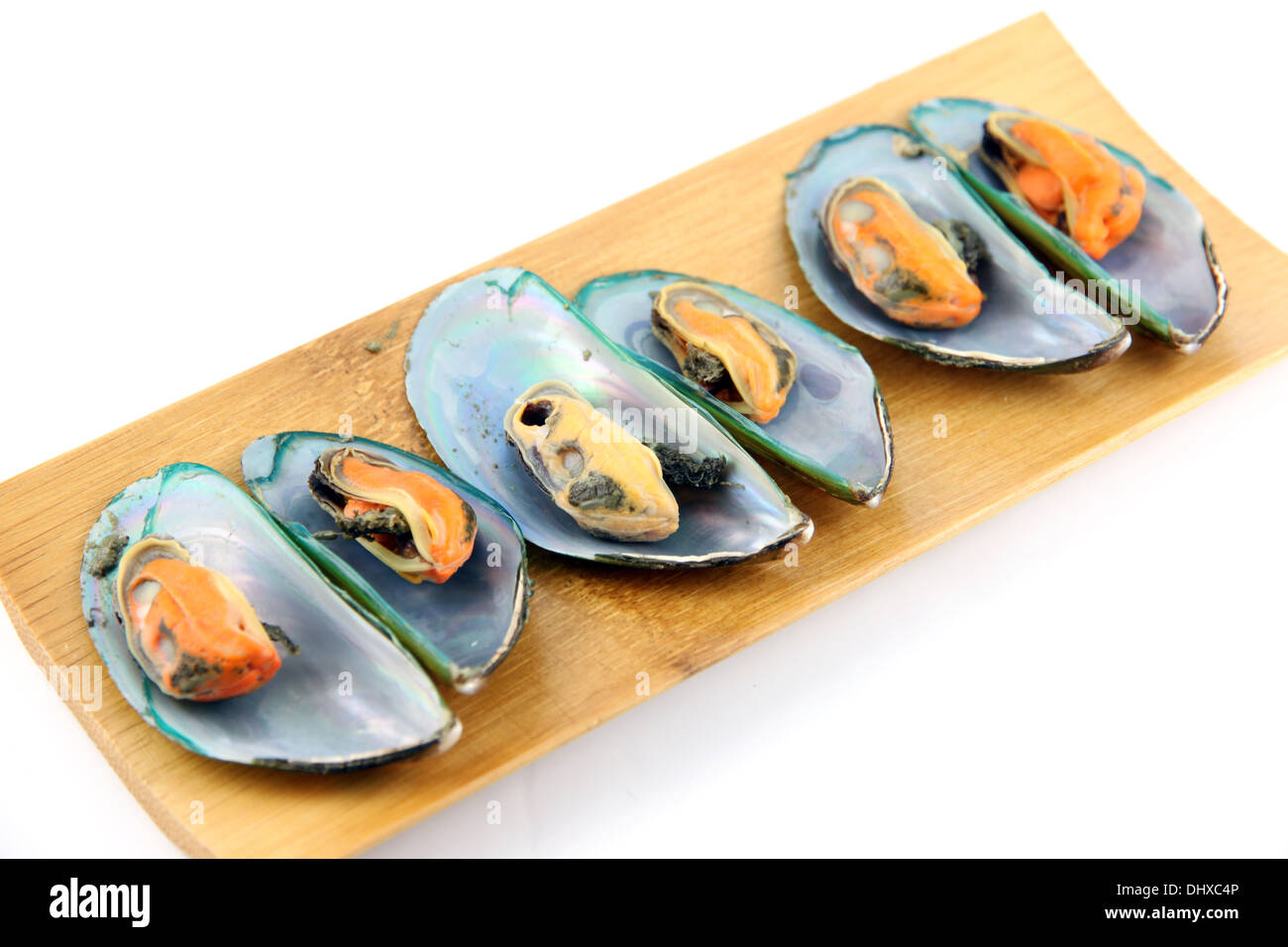 Mussel in bamboo dish on white background Stock Photo - Alamy