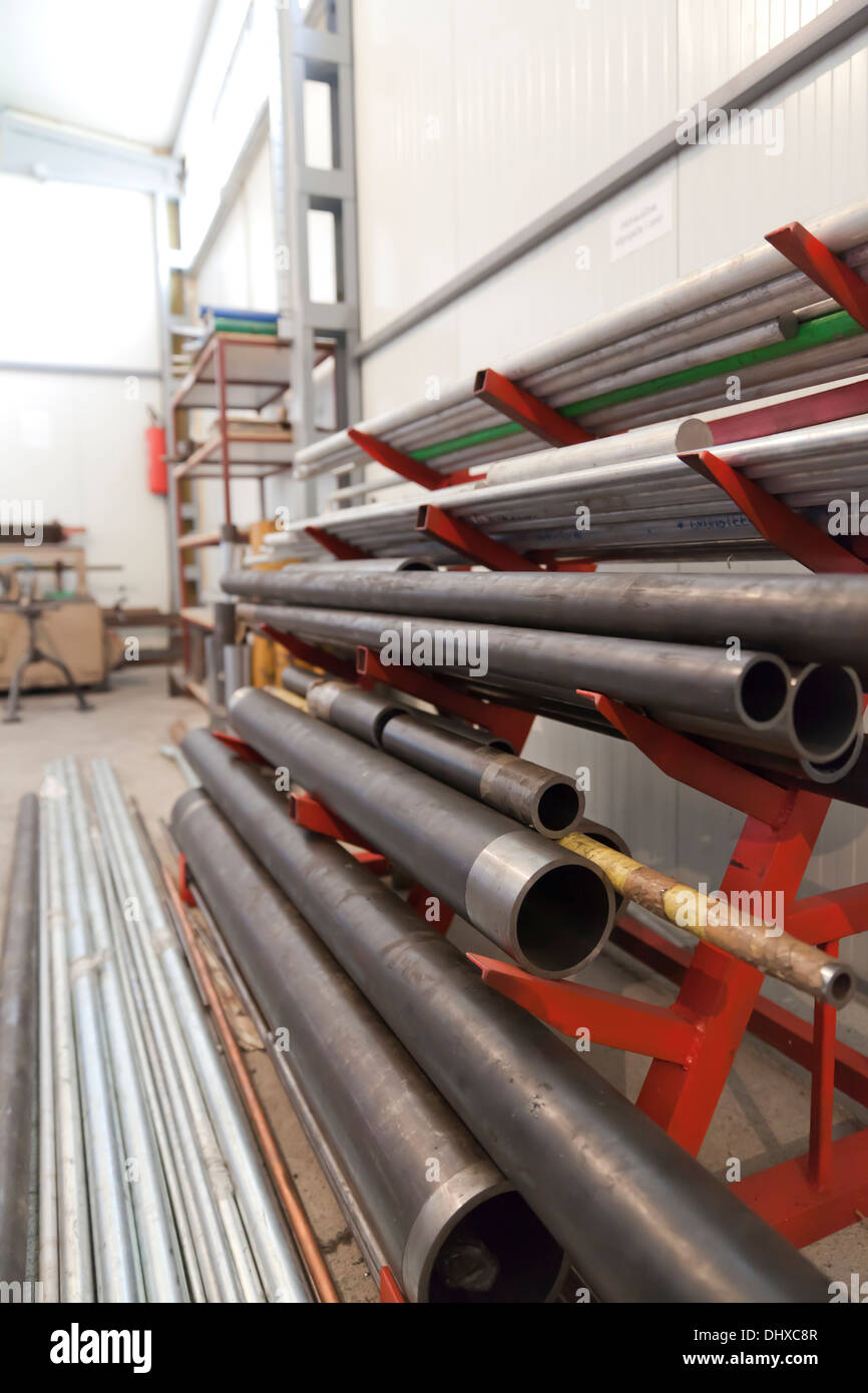 Metal pipe stack on shelf Stock Photo - Alamy